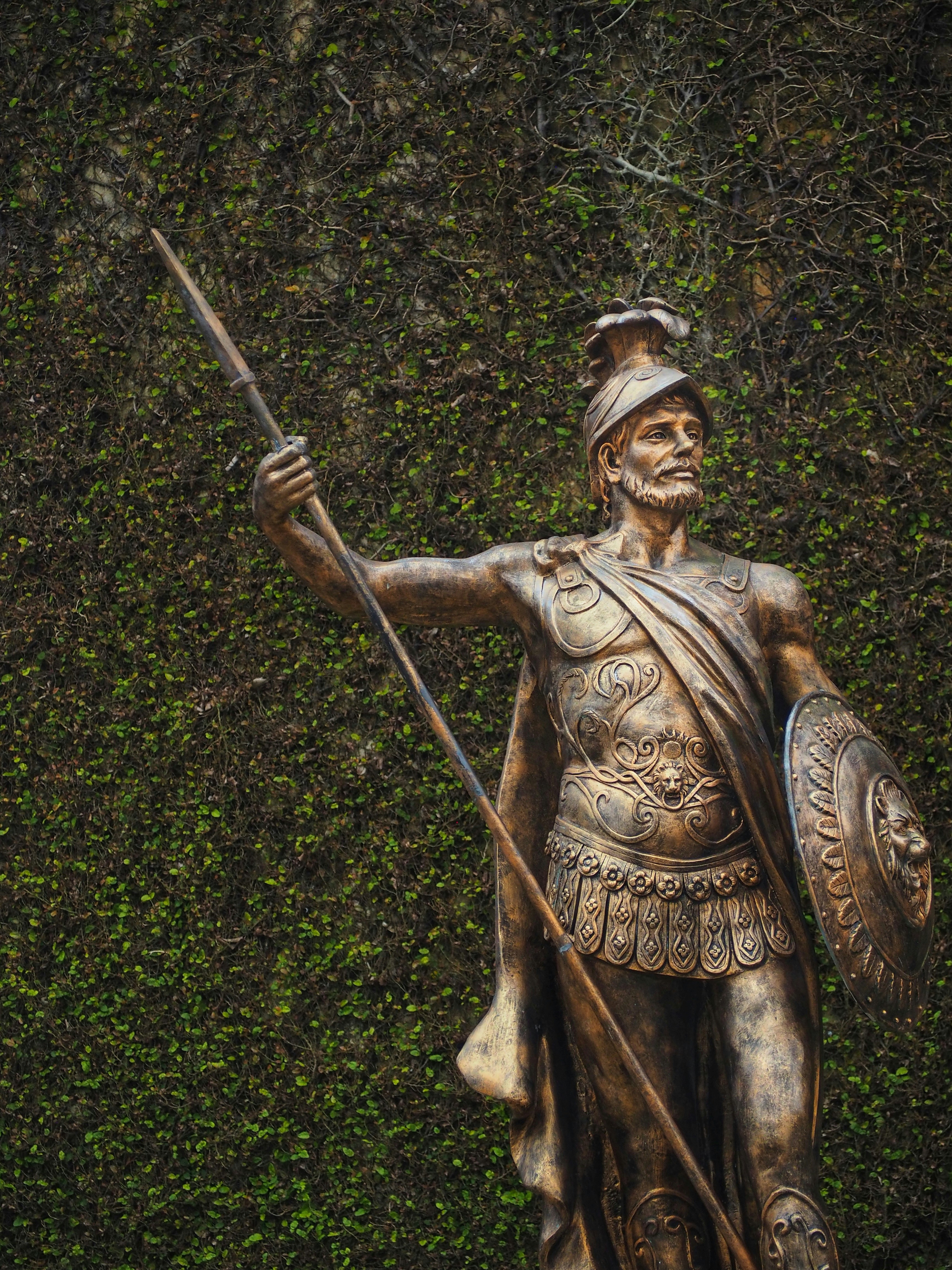 Bronze Warrior Sentinel Against Mossy Veil