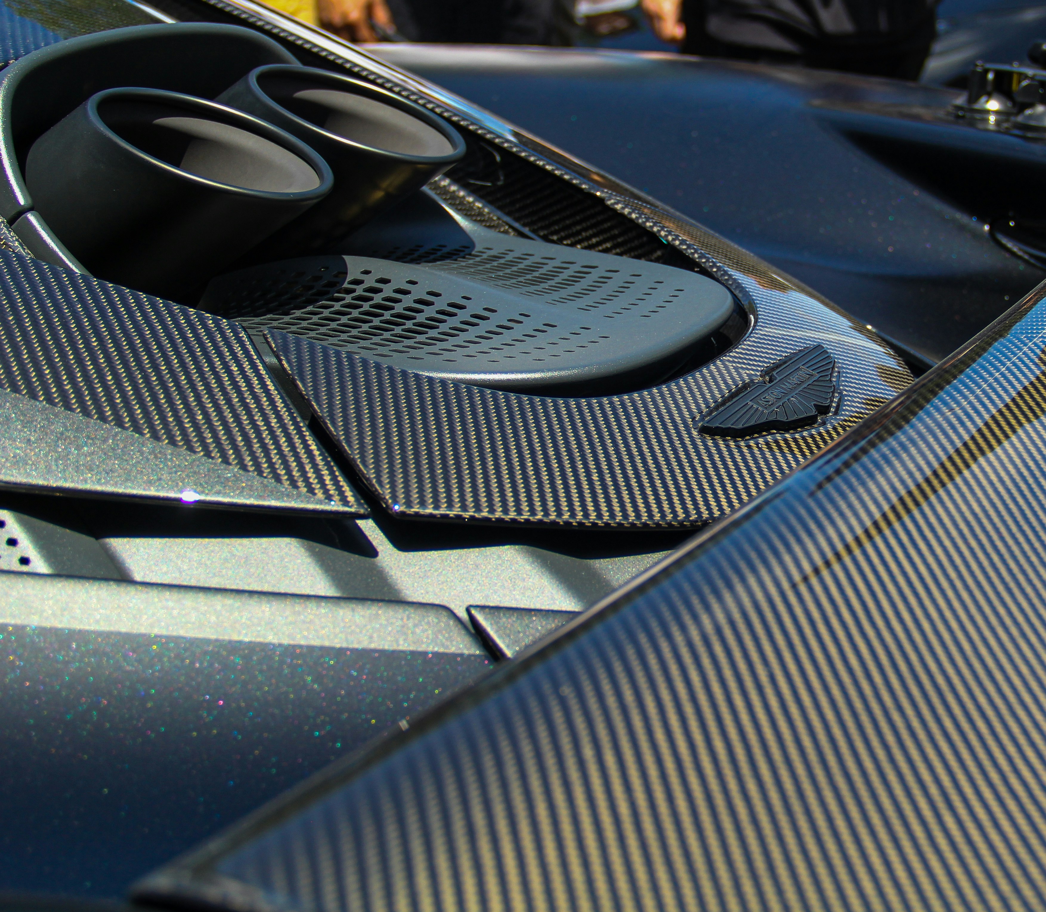 Carbon Fins and Curves: A Matte Supercar’s Textured Front