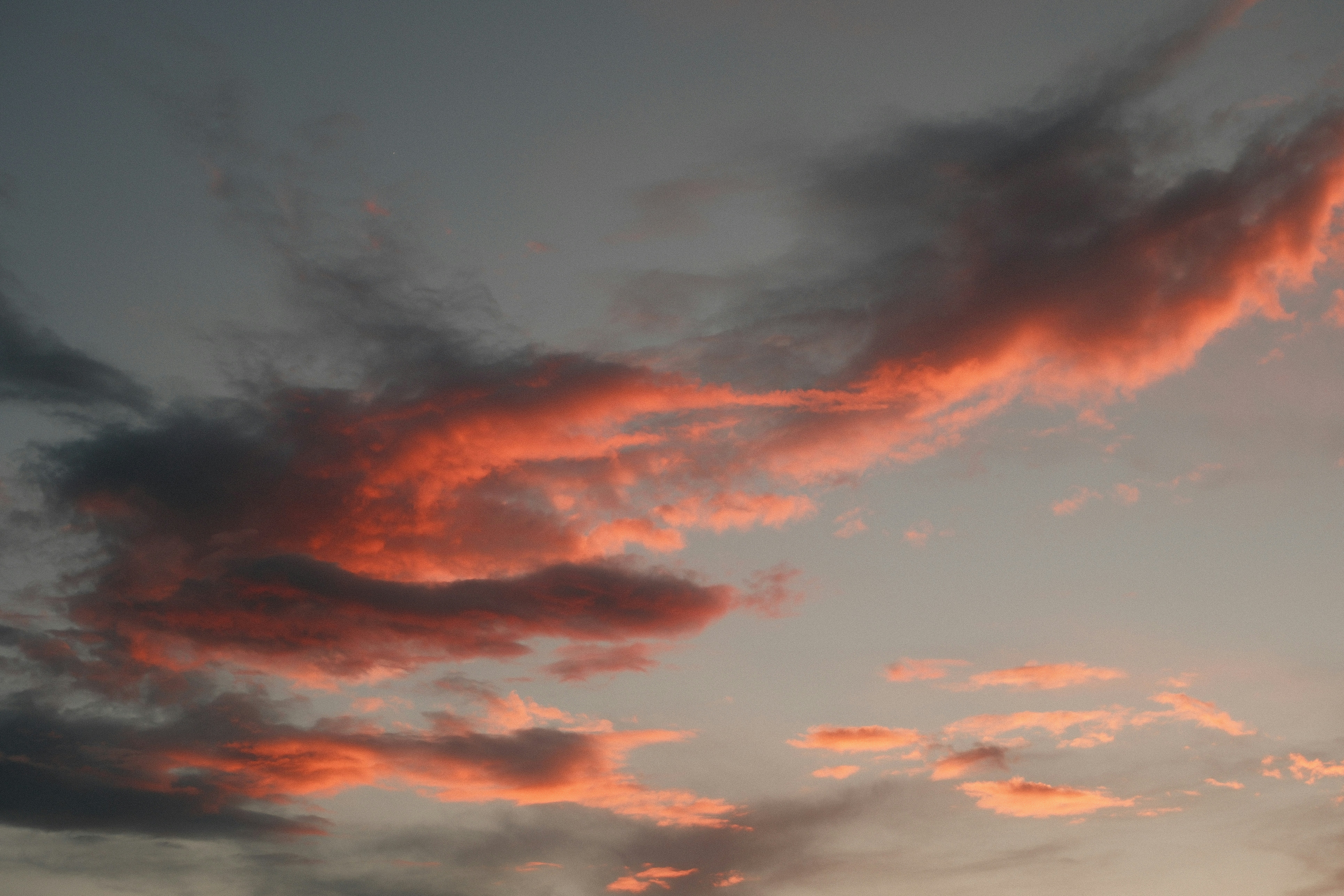 Red and orange clouds against a grey sky at sunset. photo – Free ...