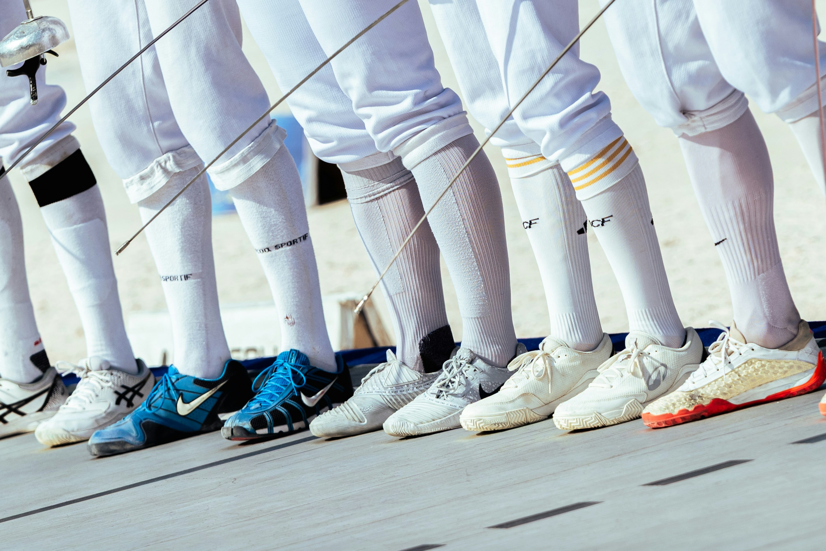 Lines of Pairing: A Row of Sneakers and Socks on the Track
