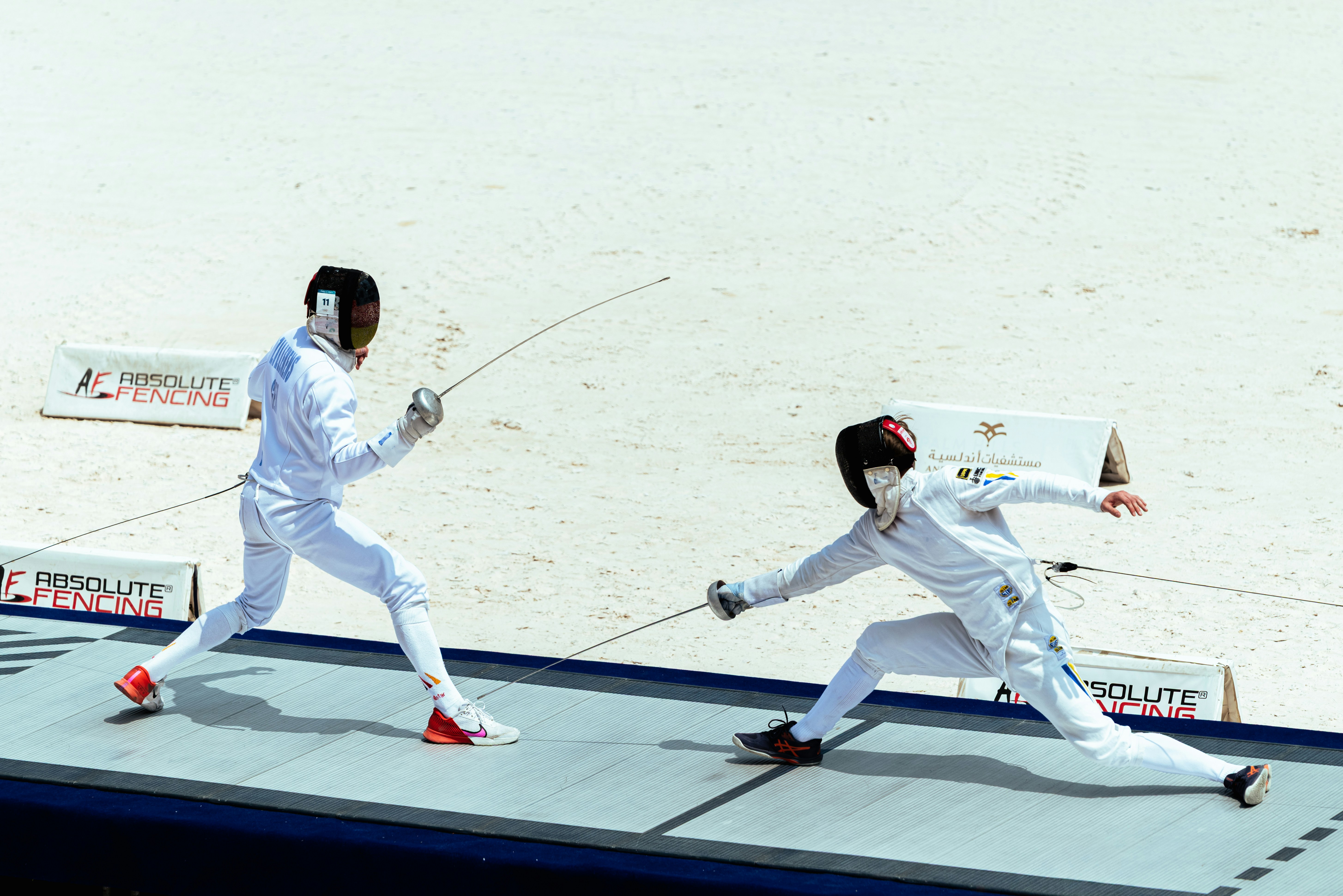 Duel on the Fencing Strip: A Moment of Precision and Focus