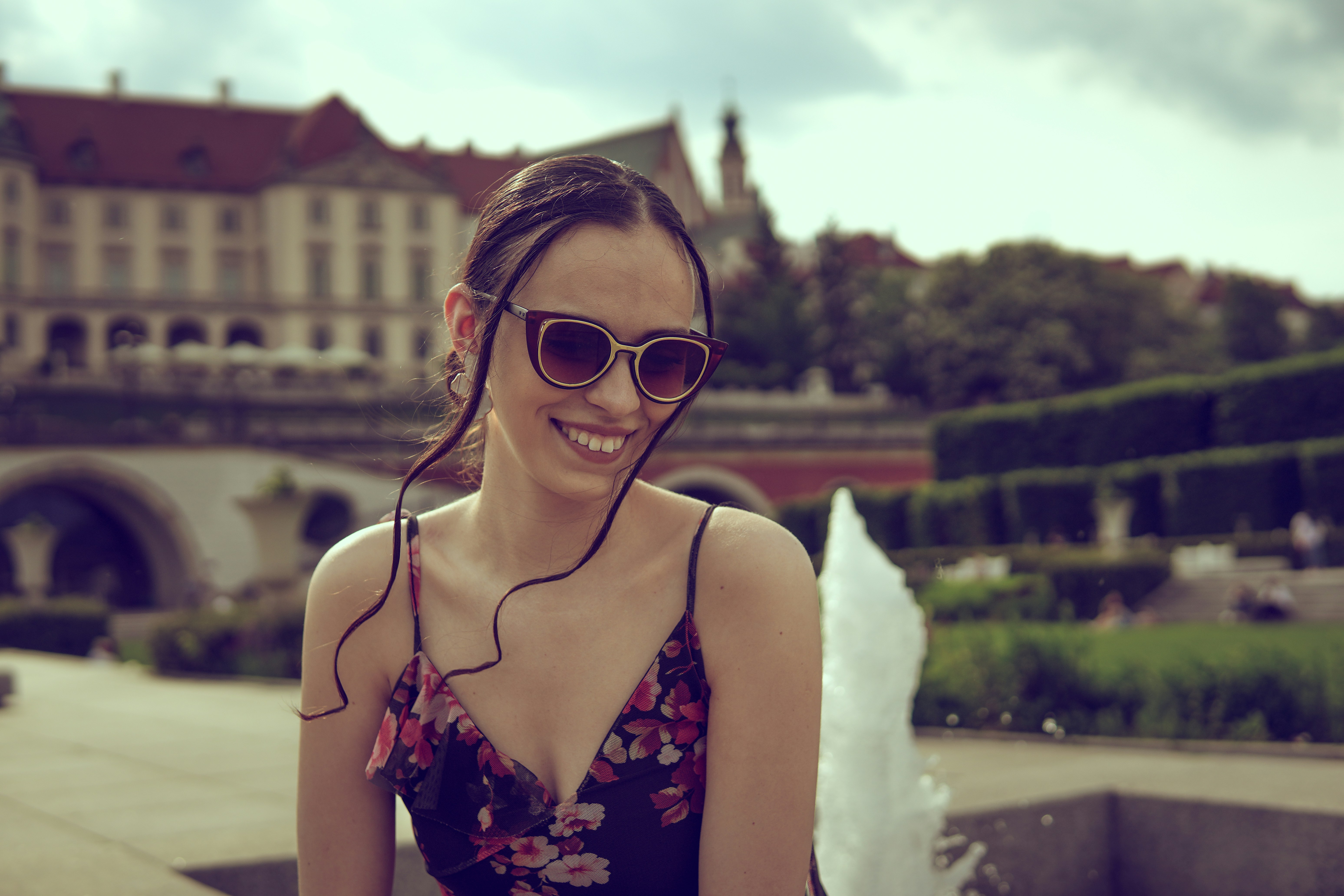 Sunlit Smiles by the Fountains: Portrait in a European Square
