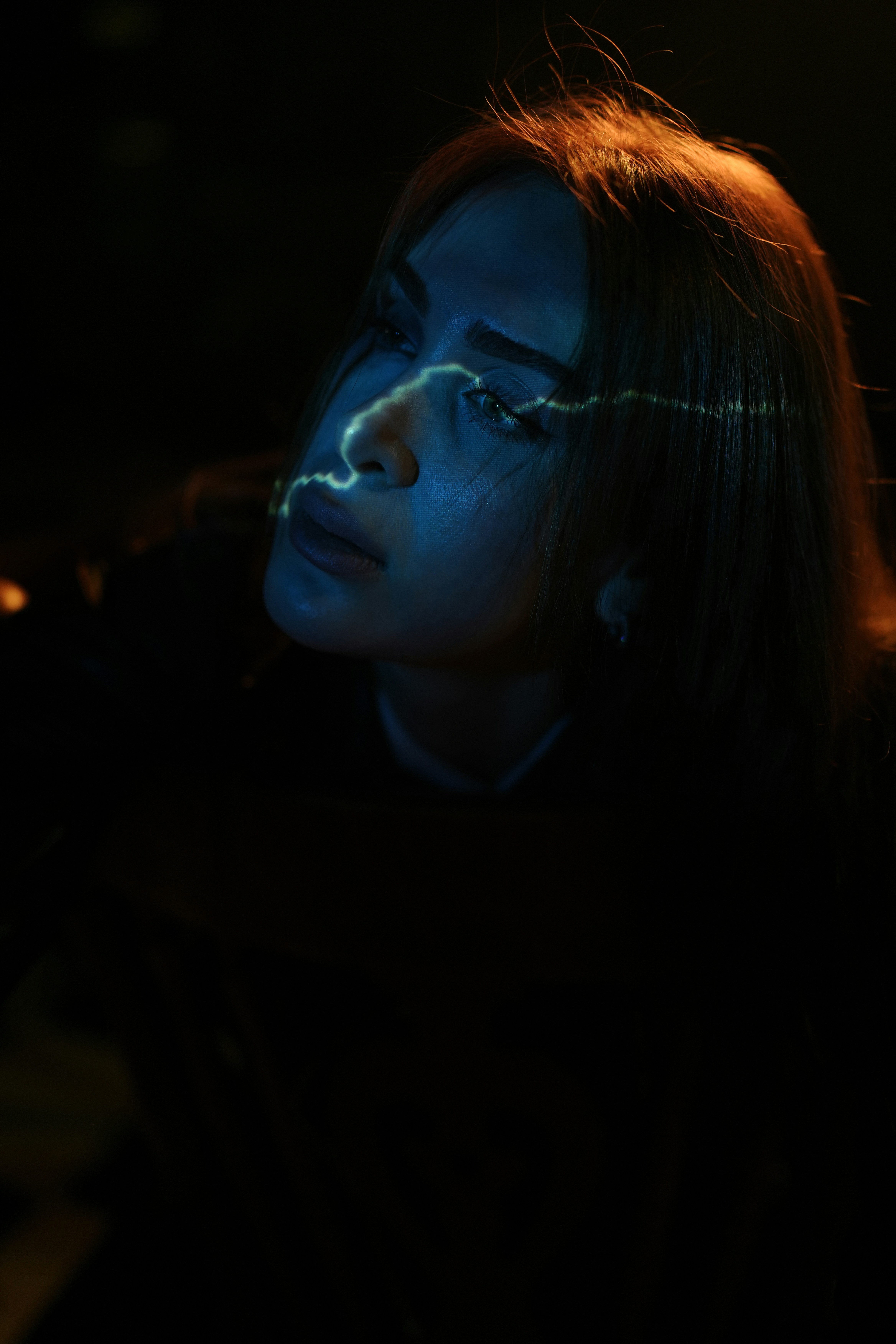 Neon Veil: Blue Light Traces a Quiet Portrait