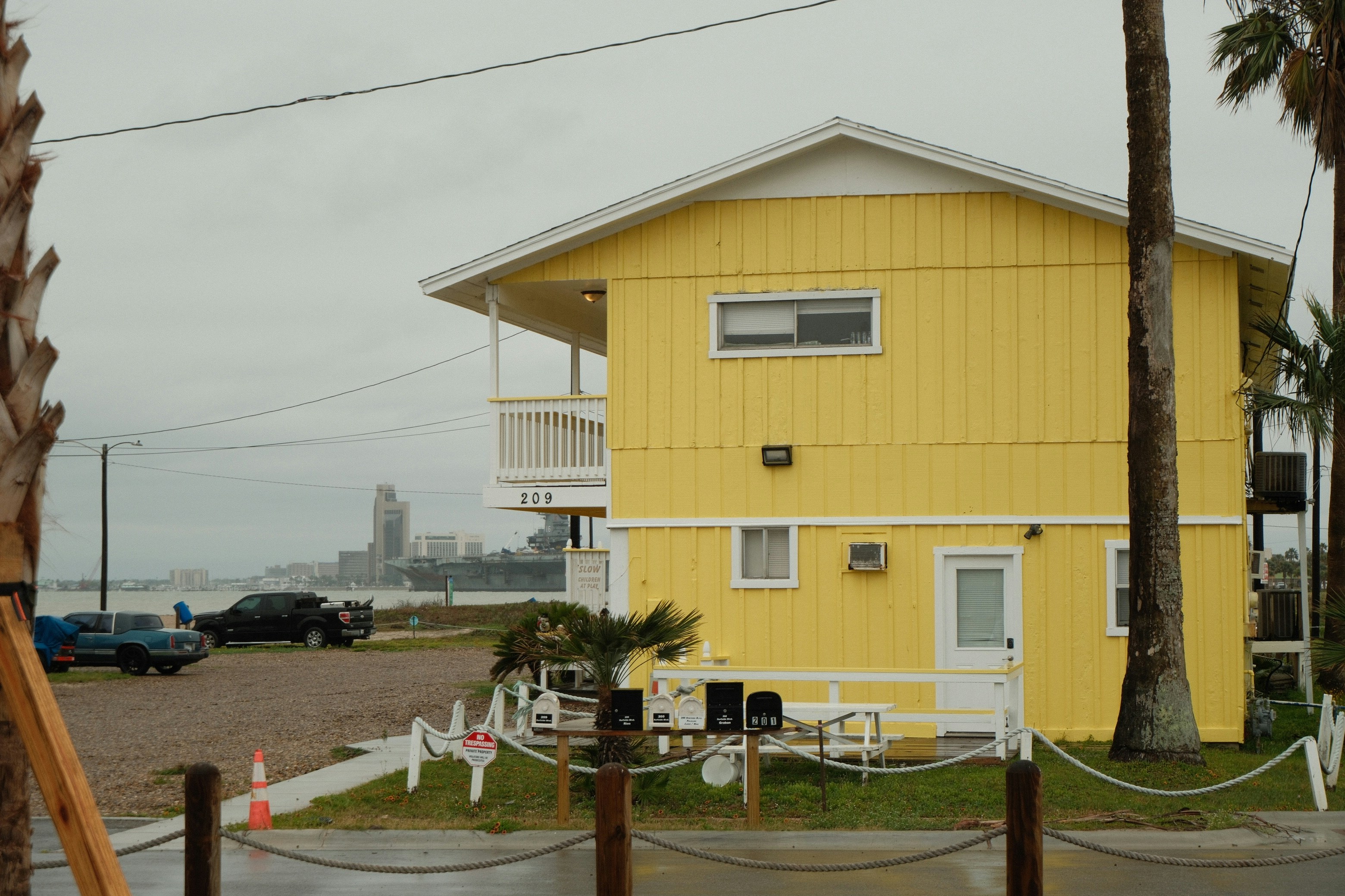 Sunlit Lifeguard House: A Bright Yellow Beachfront Residence by the Sea