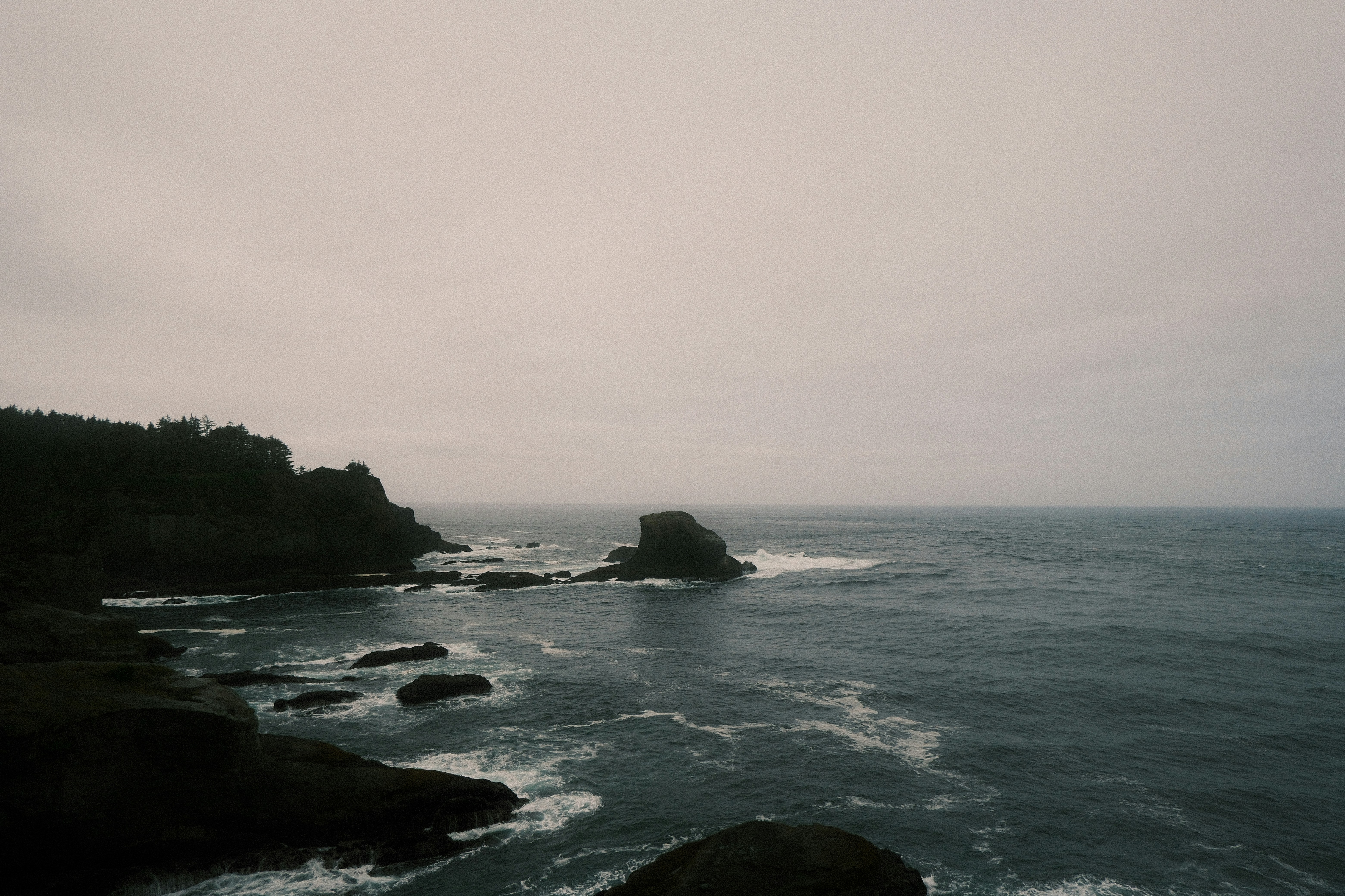 Coastal Rock Outpost Beneath a Quiet Horizon
