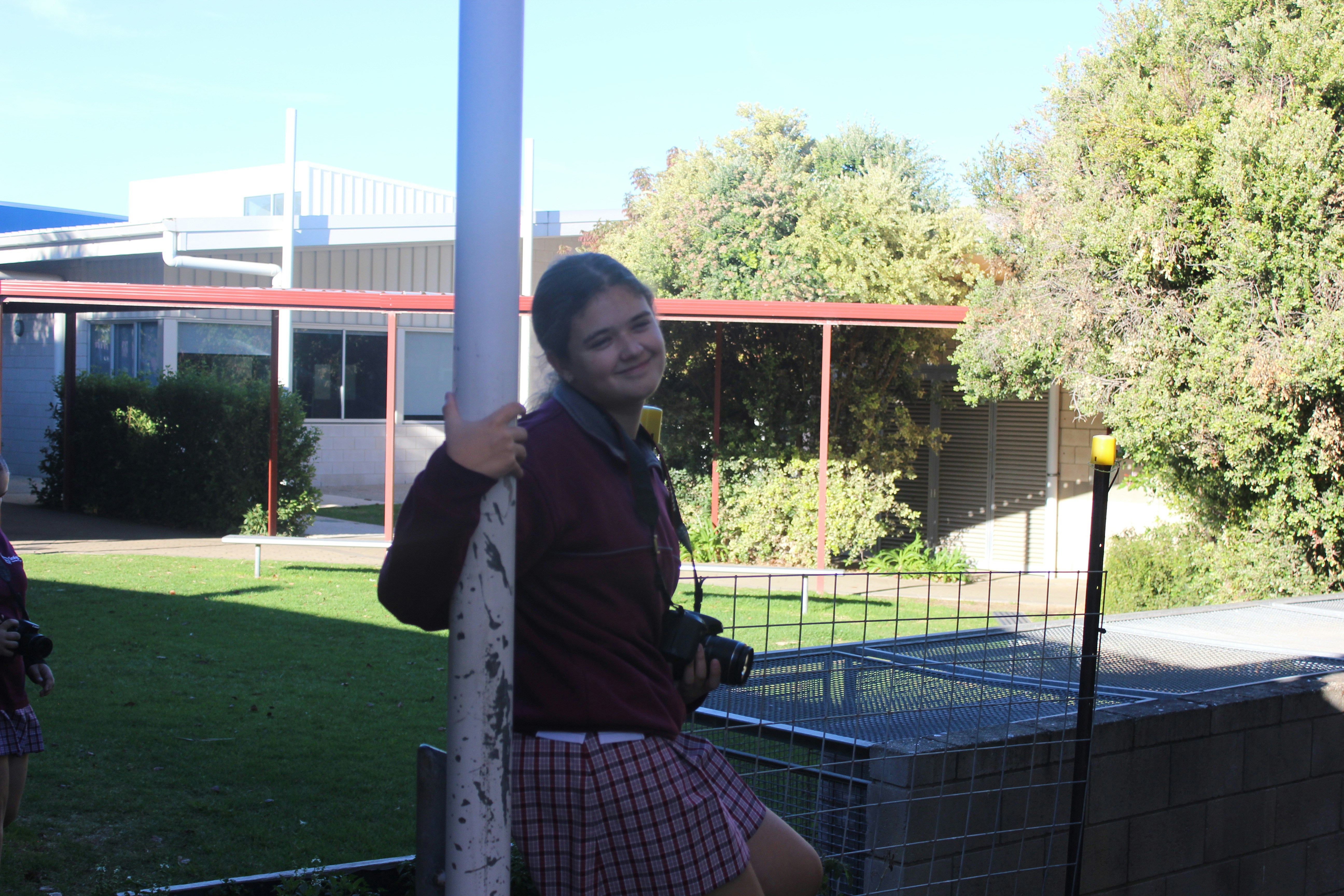 Schoolyard Swing: A Quiet Portrait by the Pole
