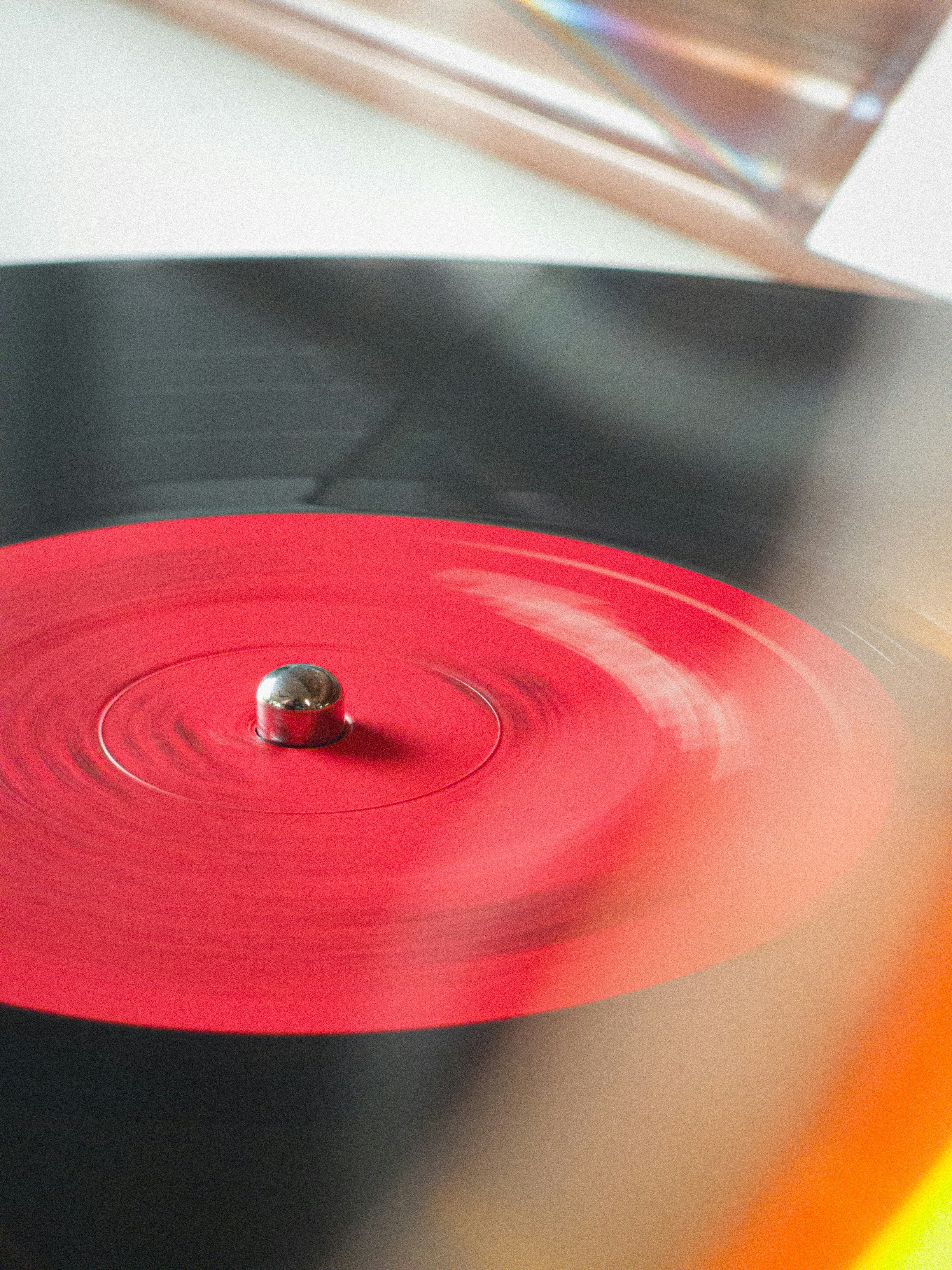 Spin Velocity: Red Vinyl in a Soft Blur