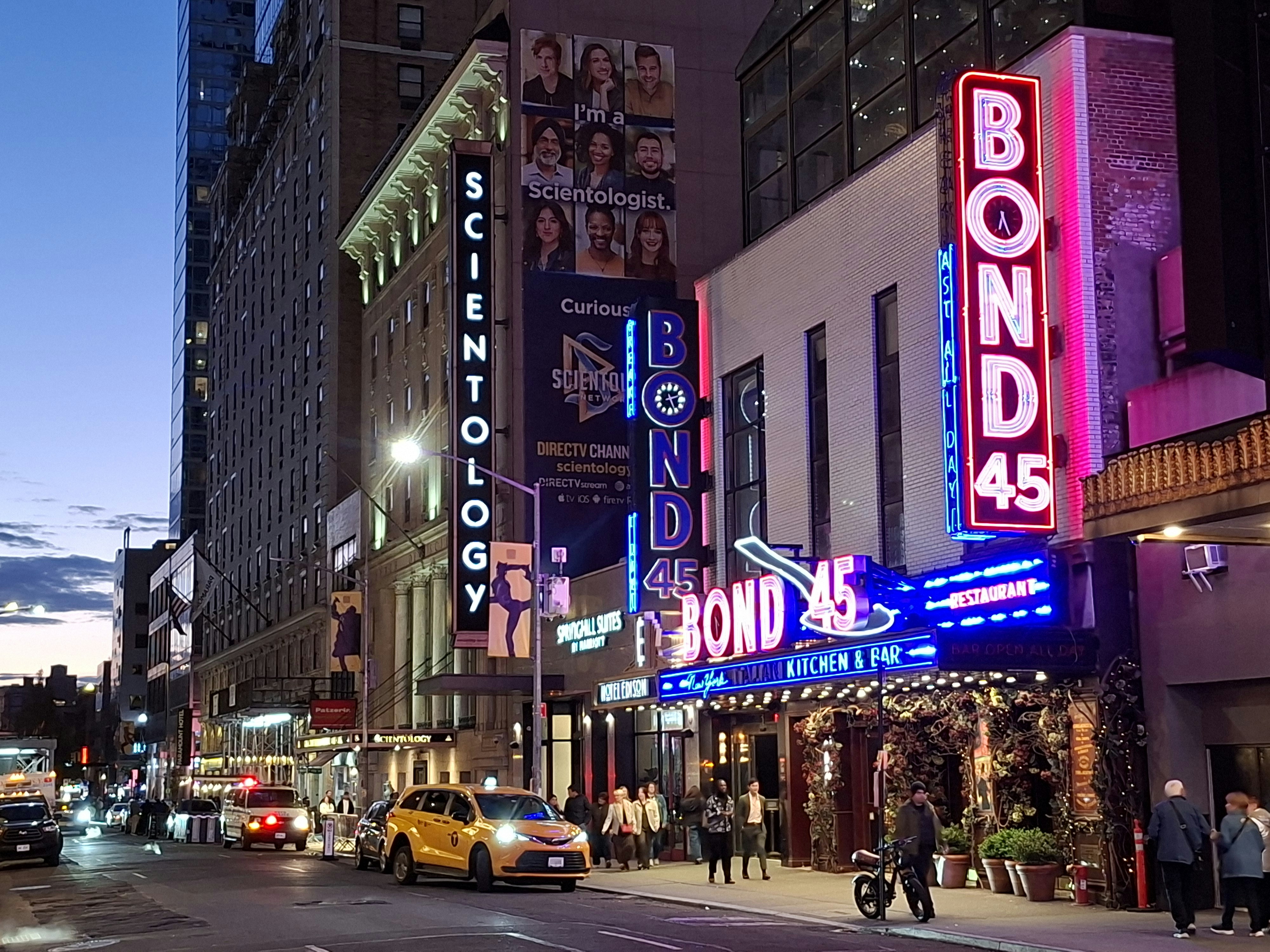 Neon Avenue: Theater District Hours After Sunset