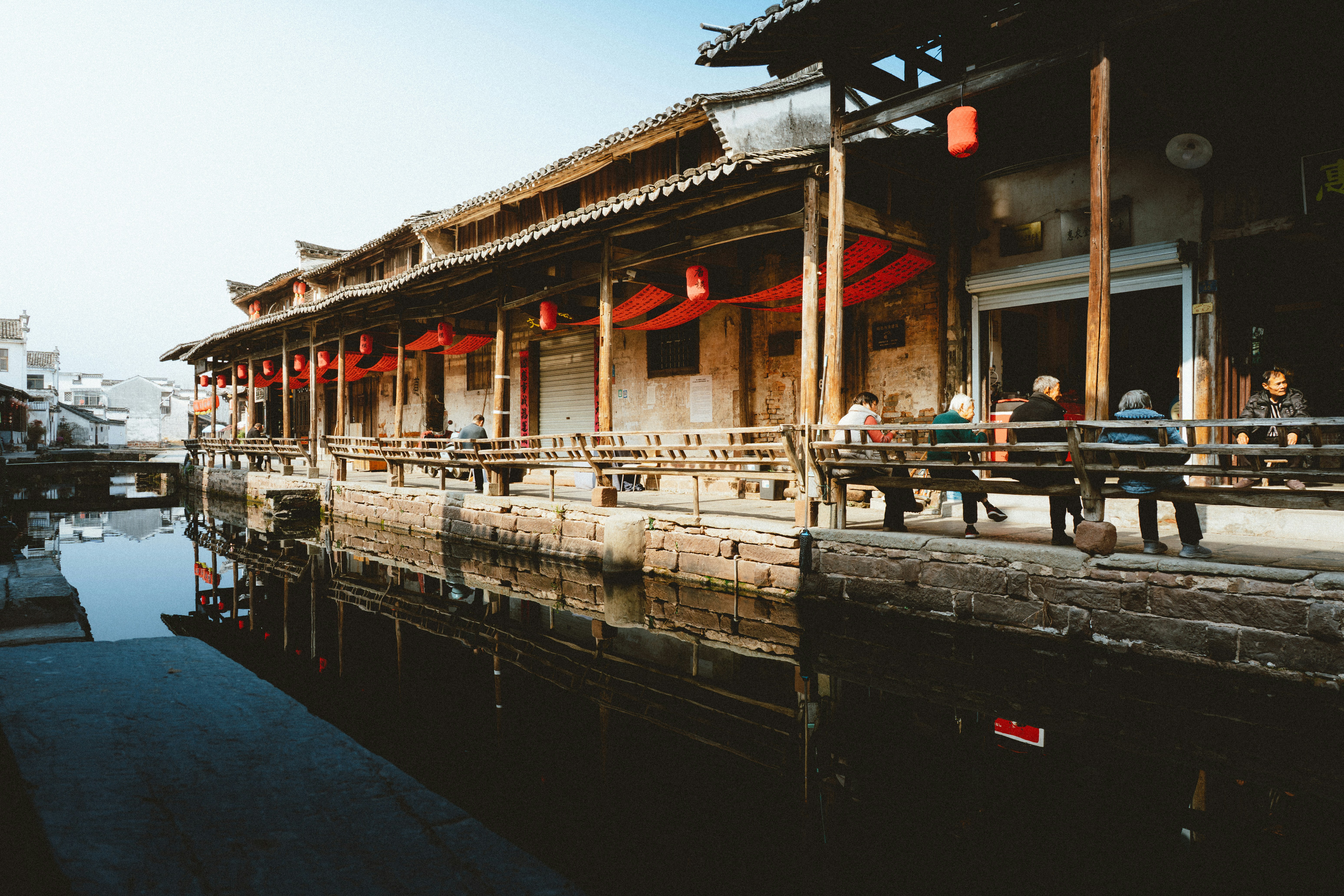 Red Lanterns Along a Timeless Riverside Alley