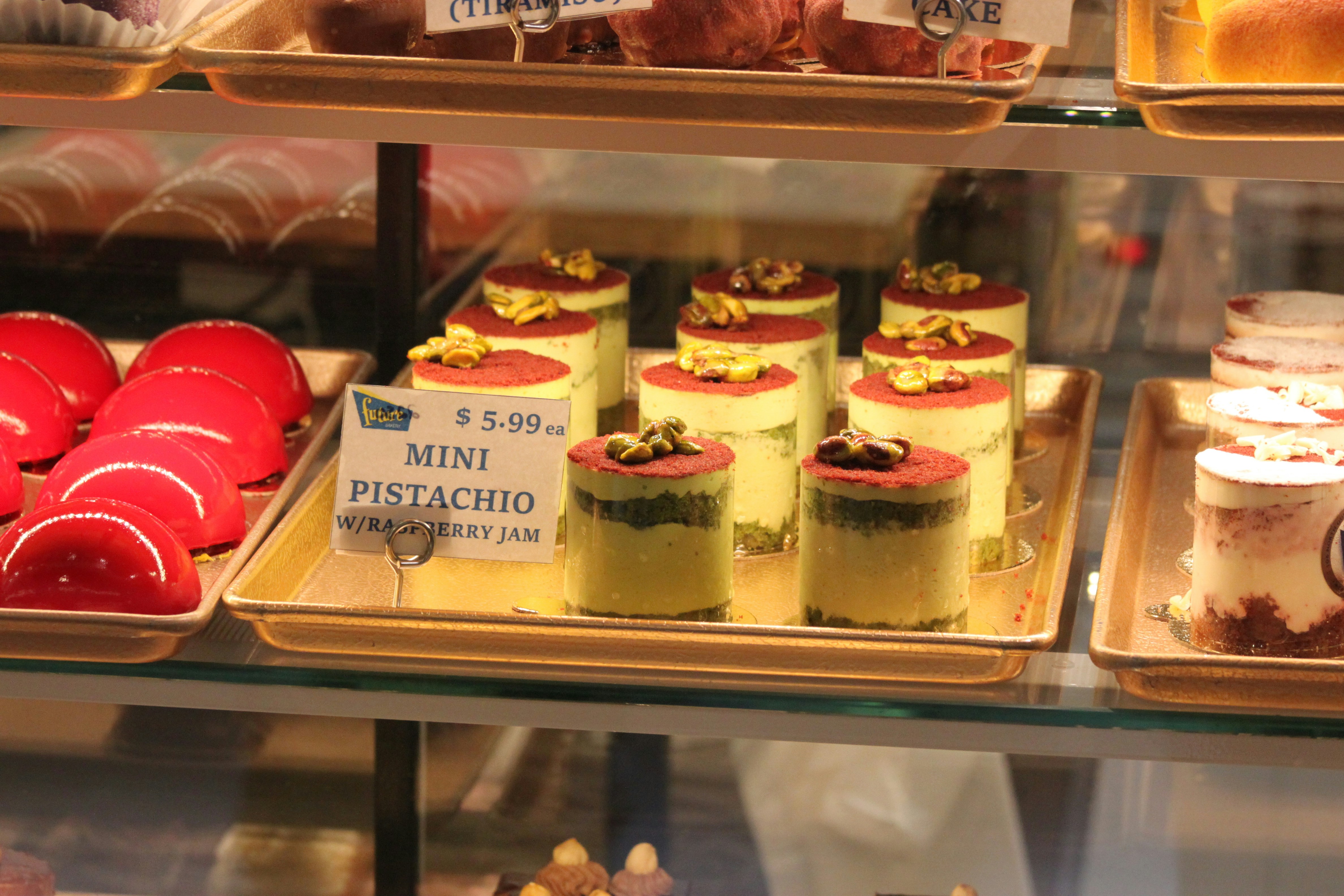 Green Pistachio Minis in a Pastry Showcase
