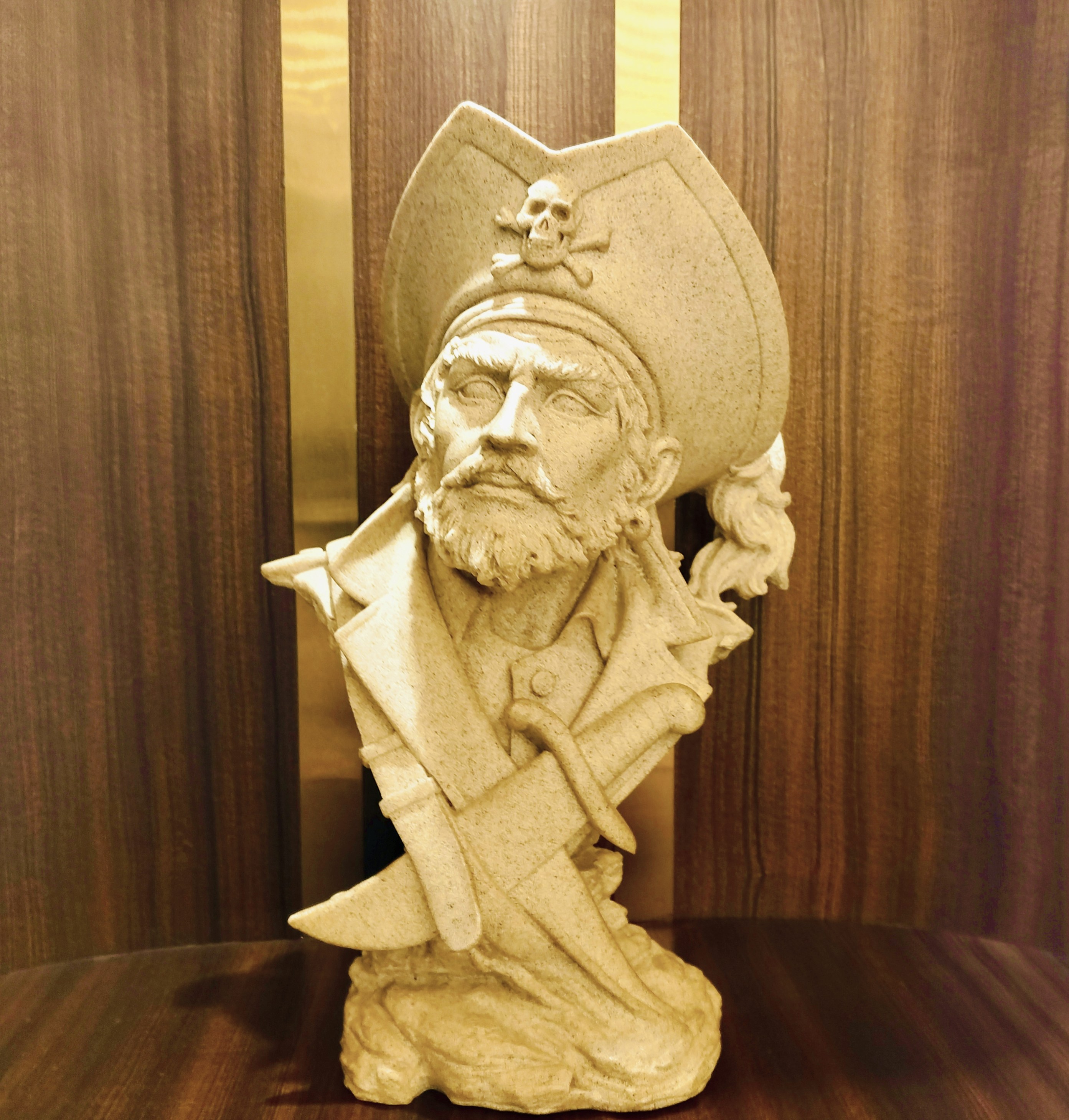 Carved Buccaneer Guardian: A Stone Pirate Statue Portrait