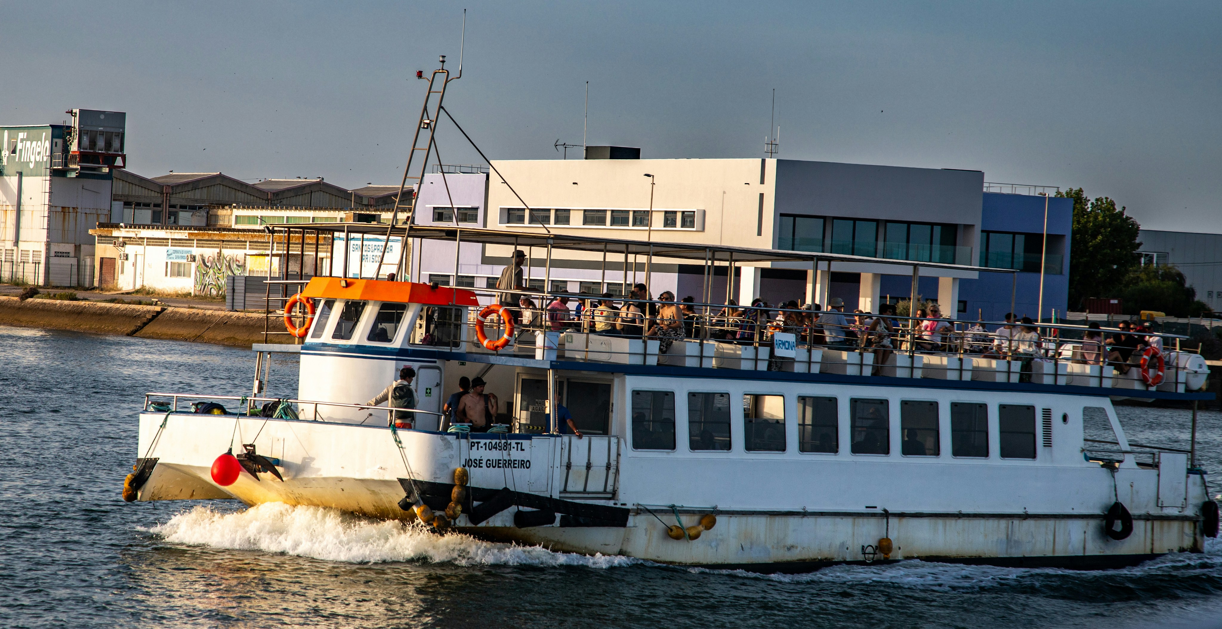 City Ferry Cutting Through the Waterfront Breeze