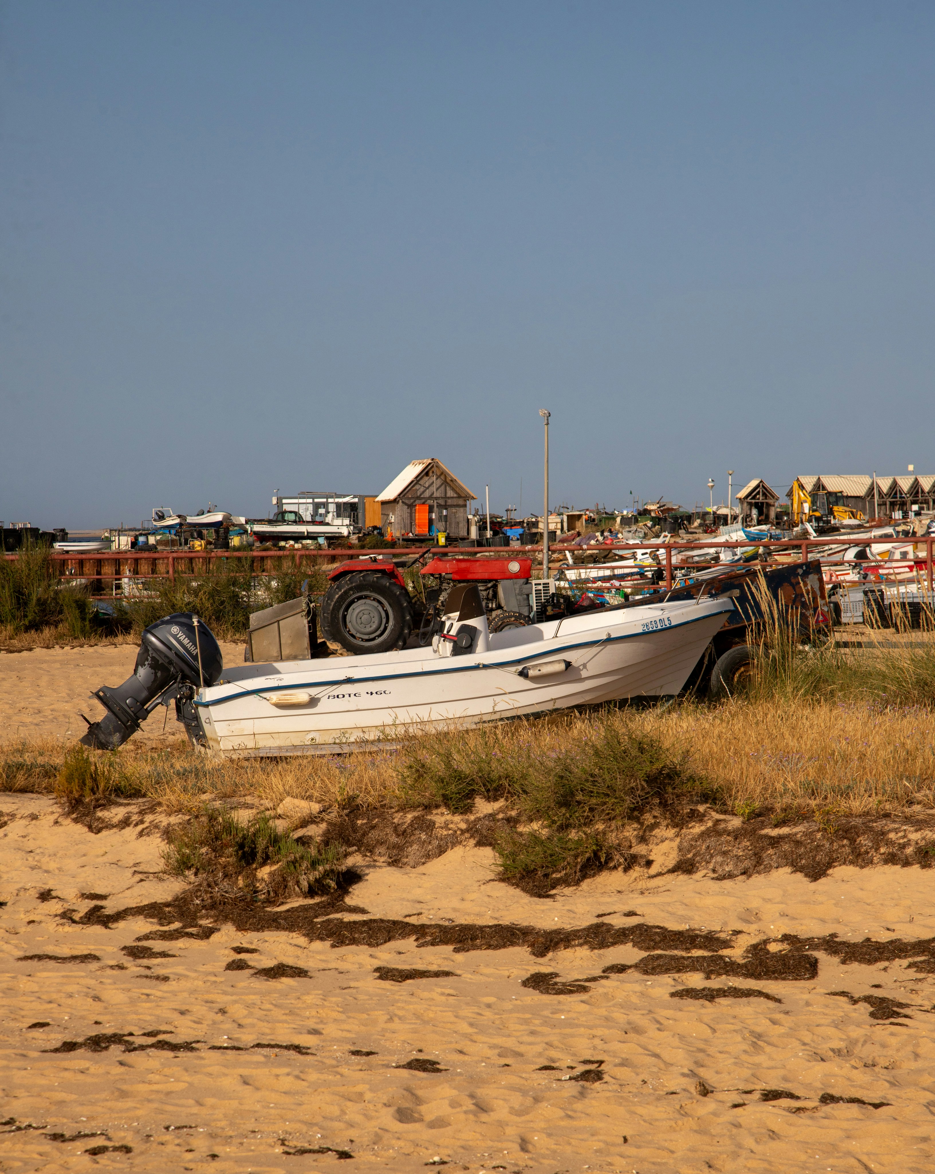 Quiet Harbor: A Beachfront Boat in Quiet Dune Remnant