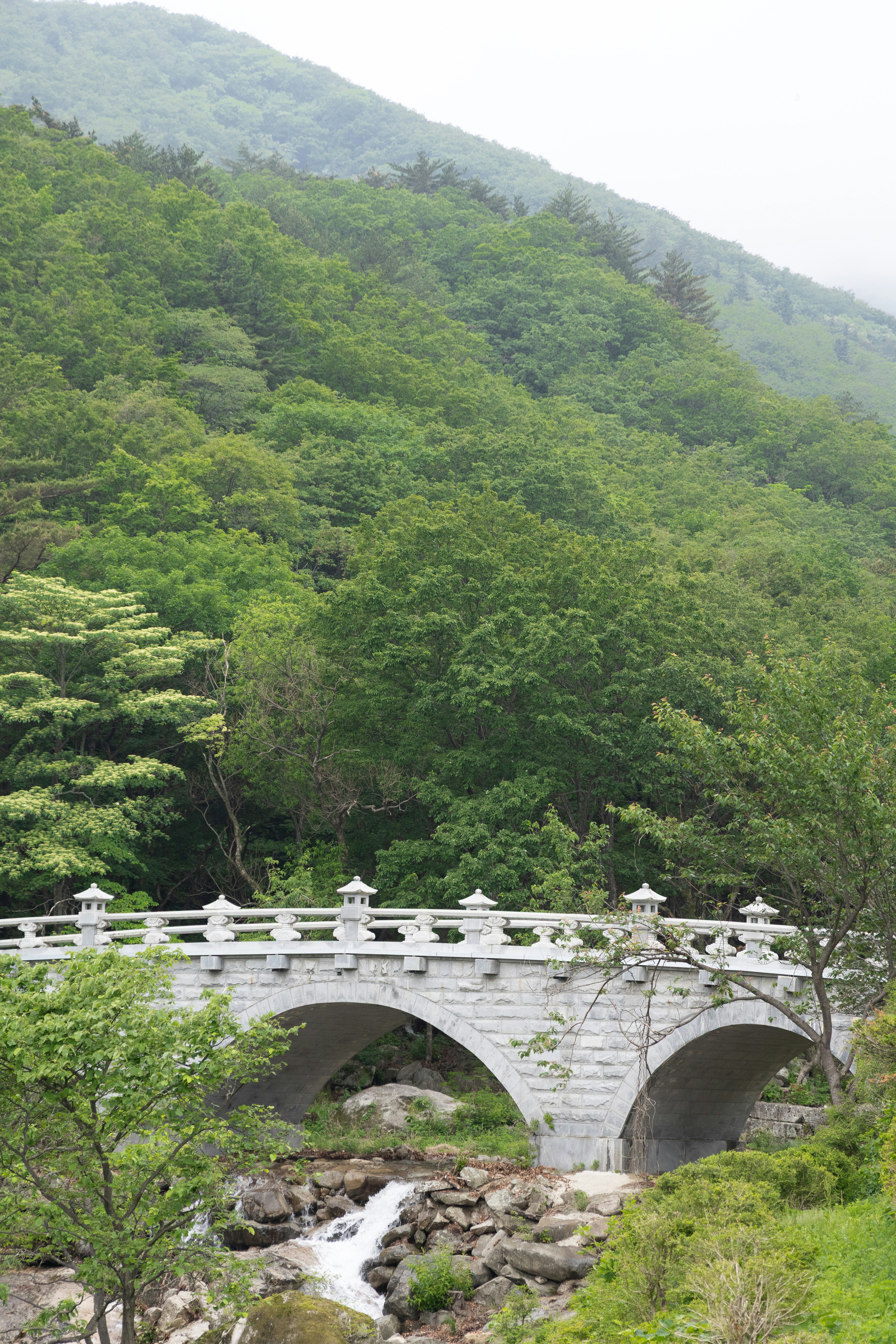 Stone Bridge Arcade over Mountain Stream