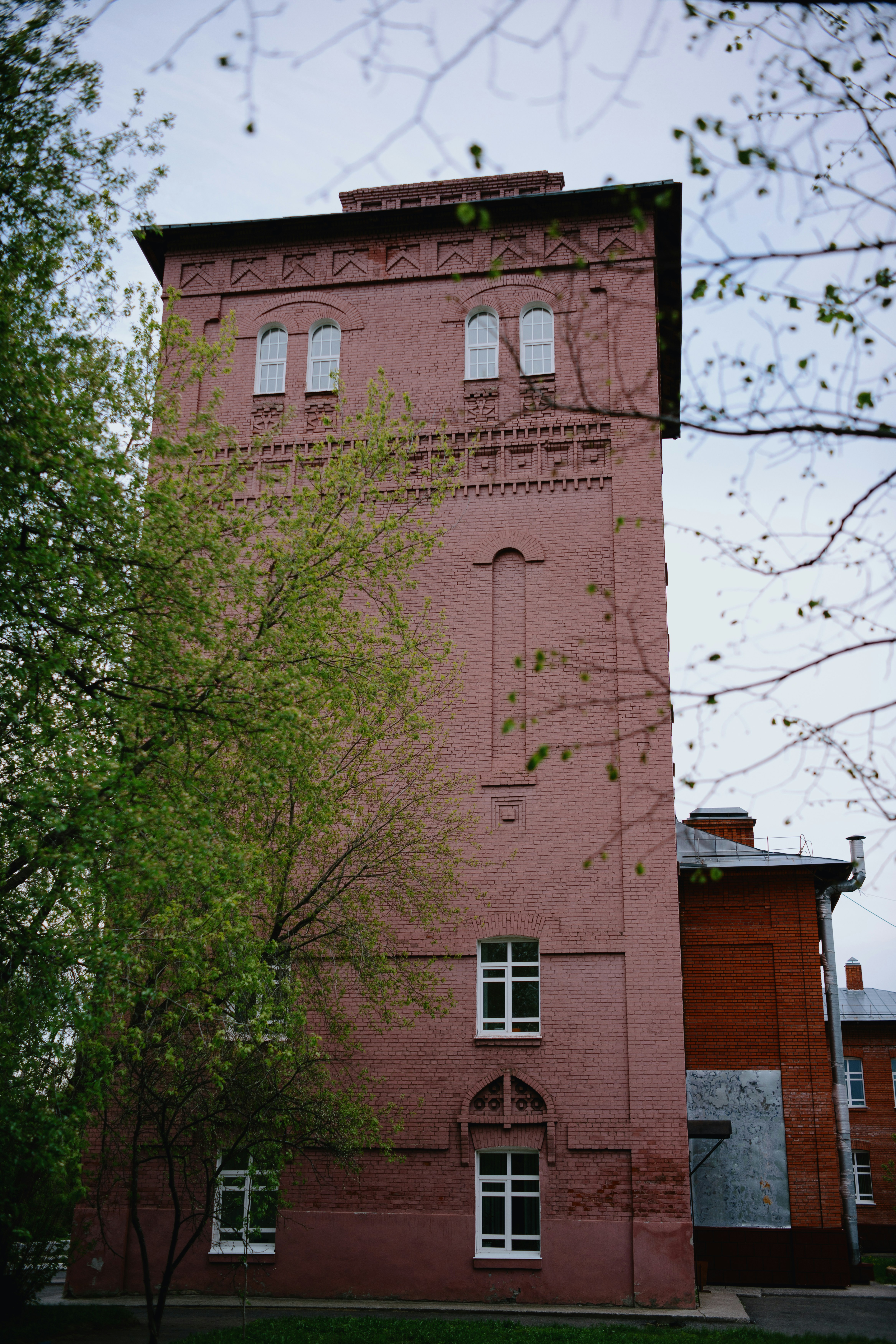 Brick Tower Amid Spring Foliage