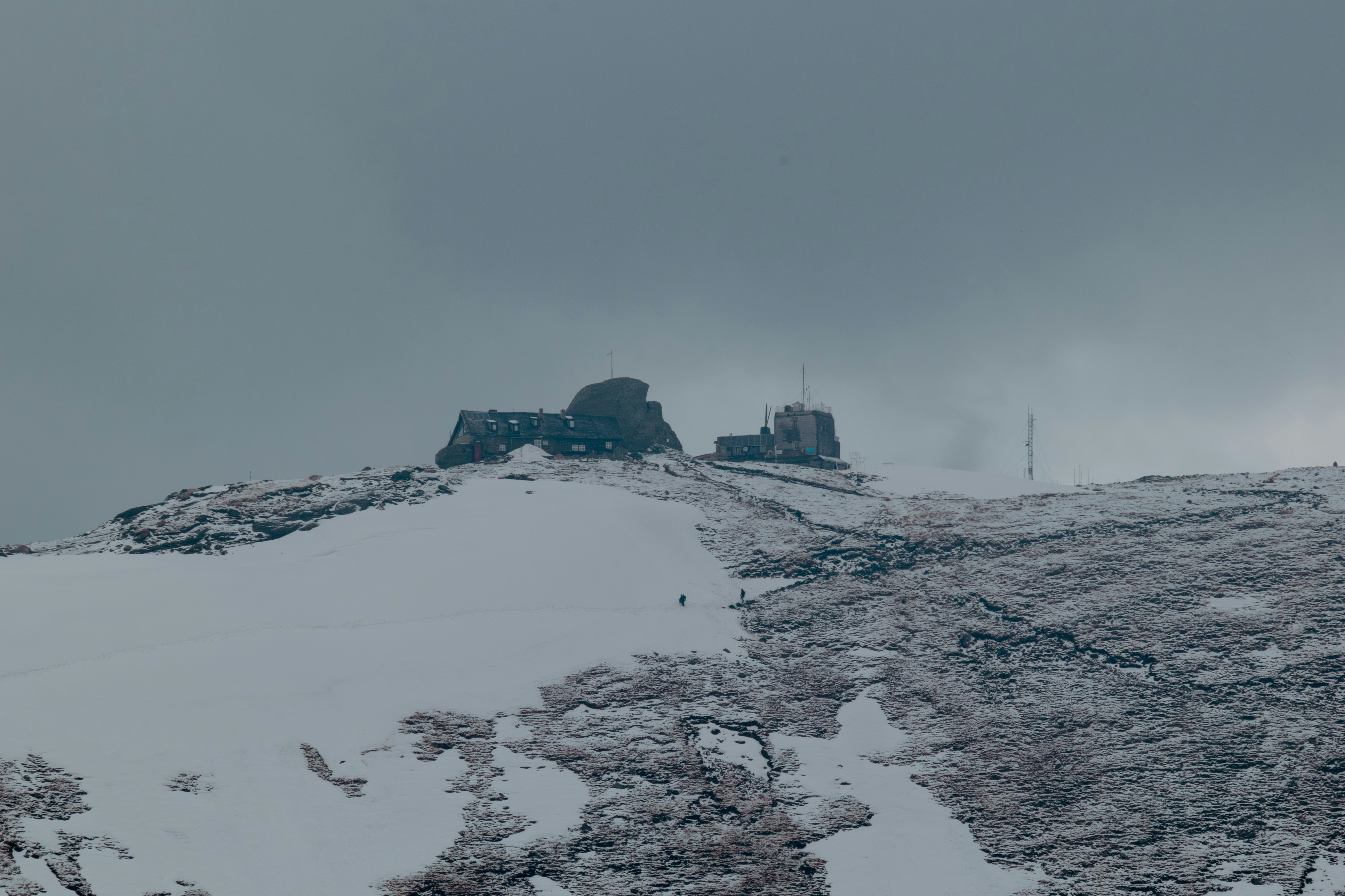 Remote Snowbound Outpost Under Threatening Skies
