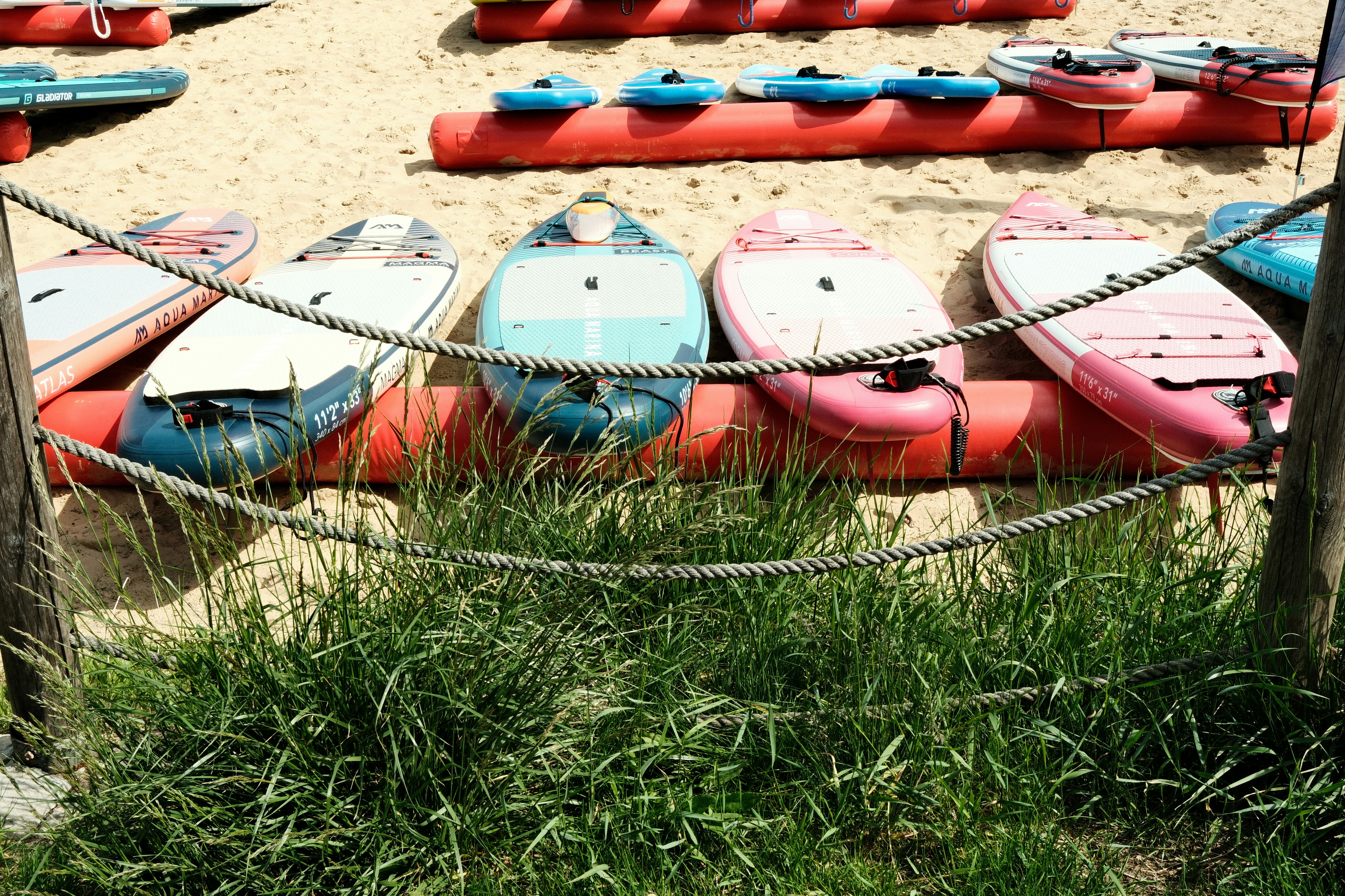 Colorful Surfer Floats Resting at the Shoreline