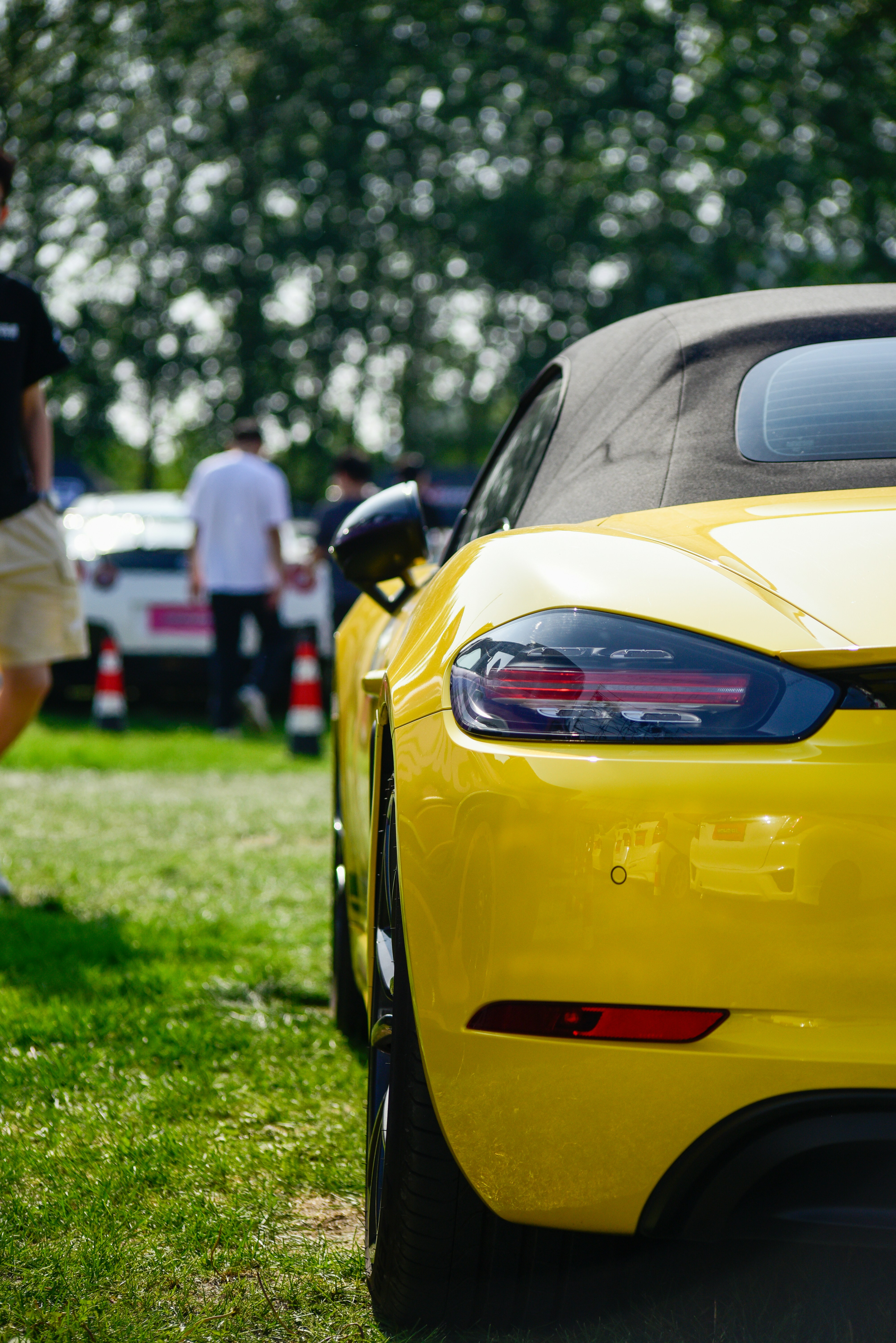 Yellow Convertible Reveal: Close-Up of a Front-Stounding Porsche from a Car Show