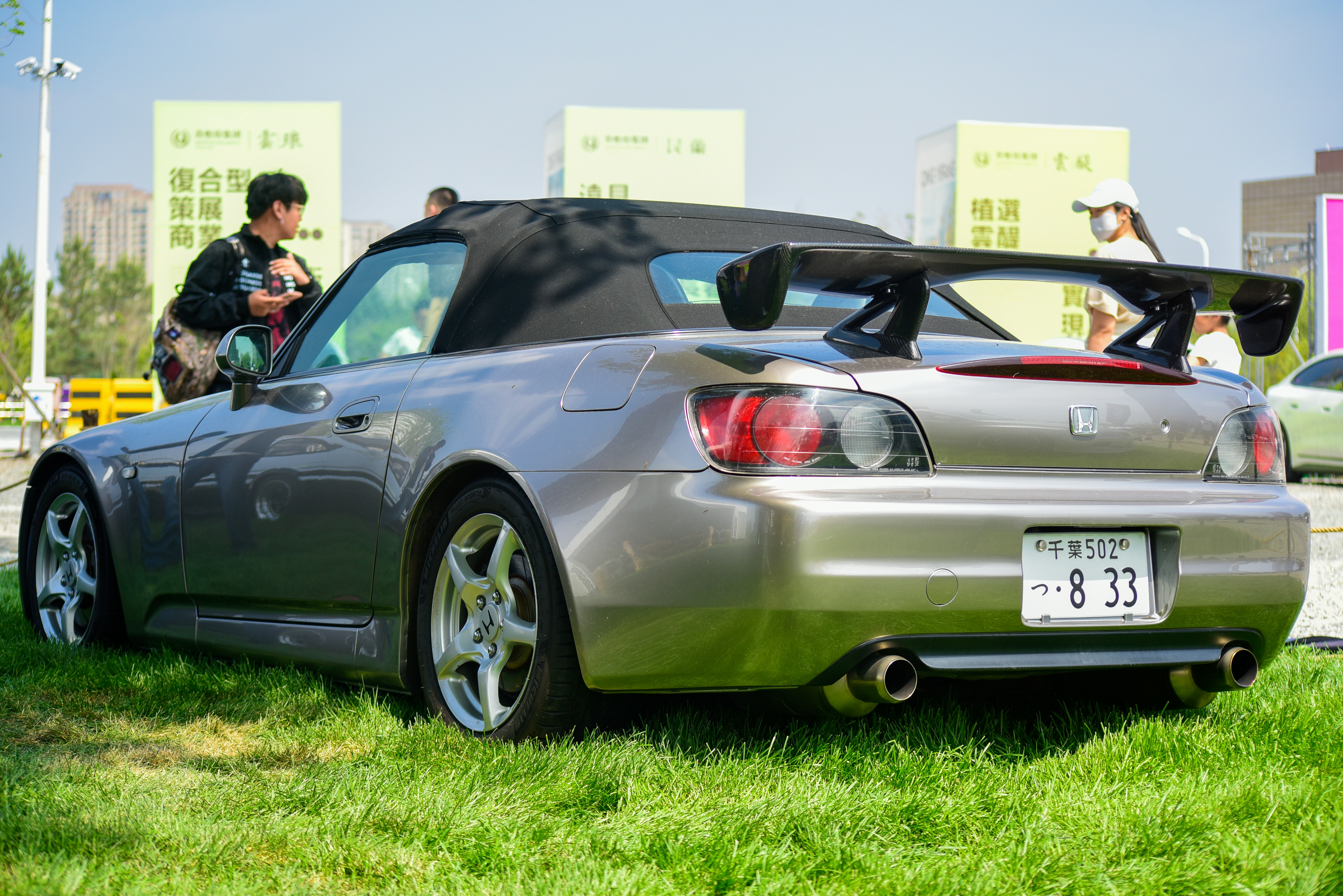Silver Convertible in a Sunlit Park showdown