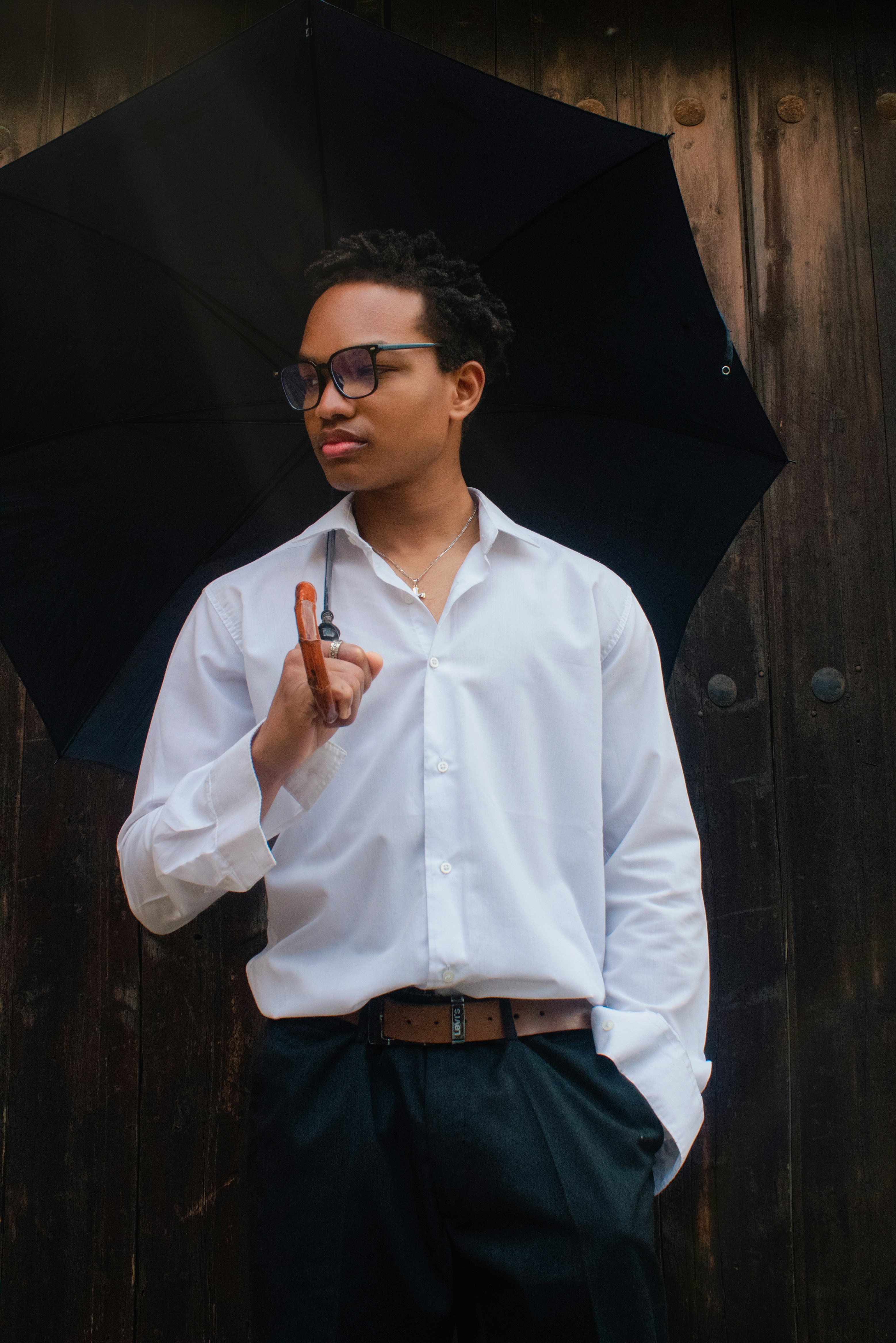 Gentleman with Umbrella: Urban Poise and The Caramel-Toned Microphone