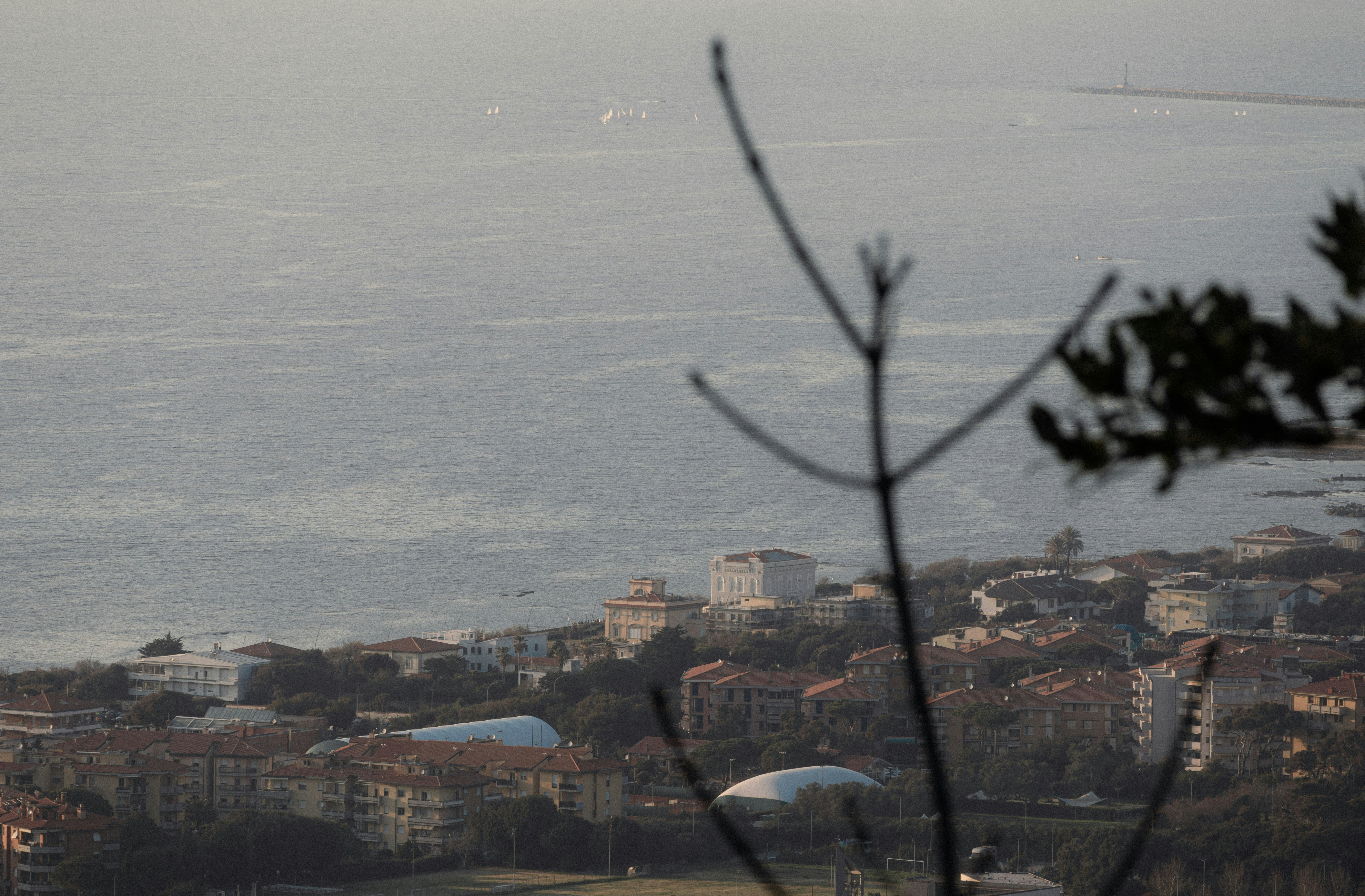 Coastal townscape slipping into the sea mist