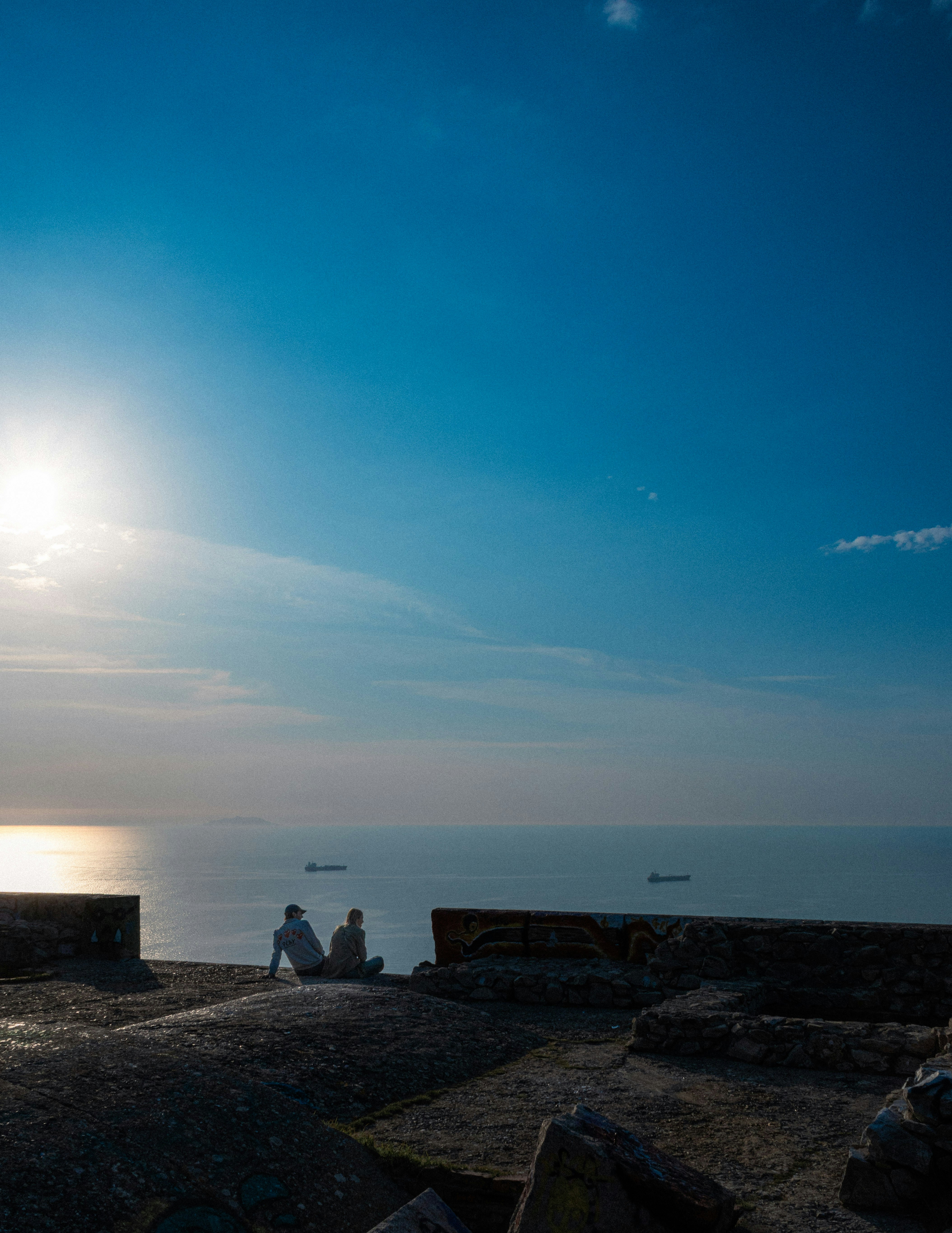 Sunlit Sea Wall: Quiet moment by the horizon