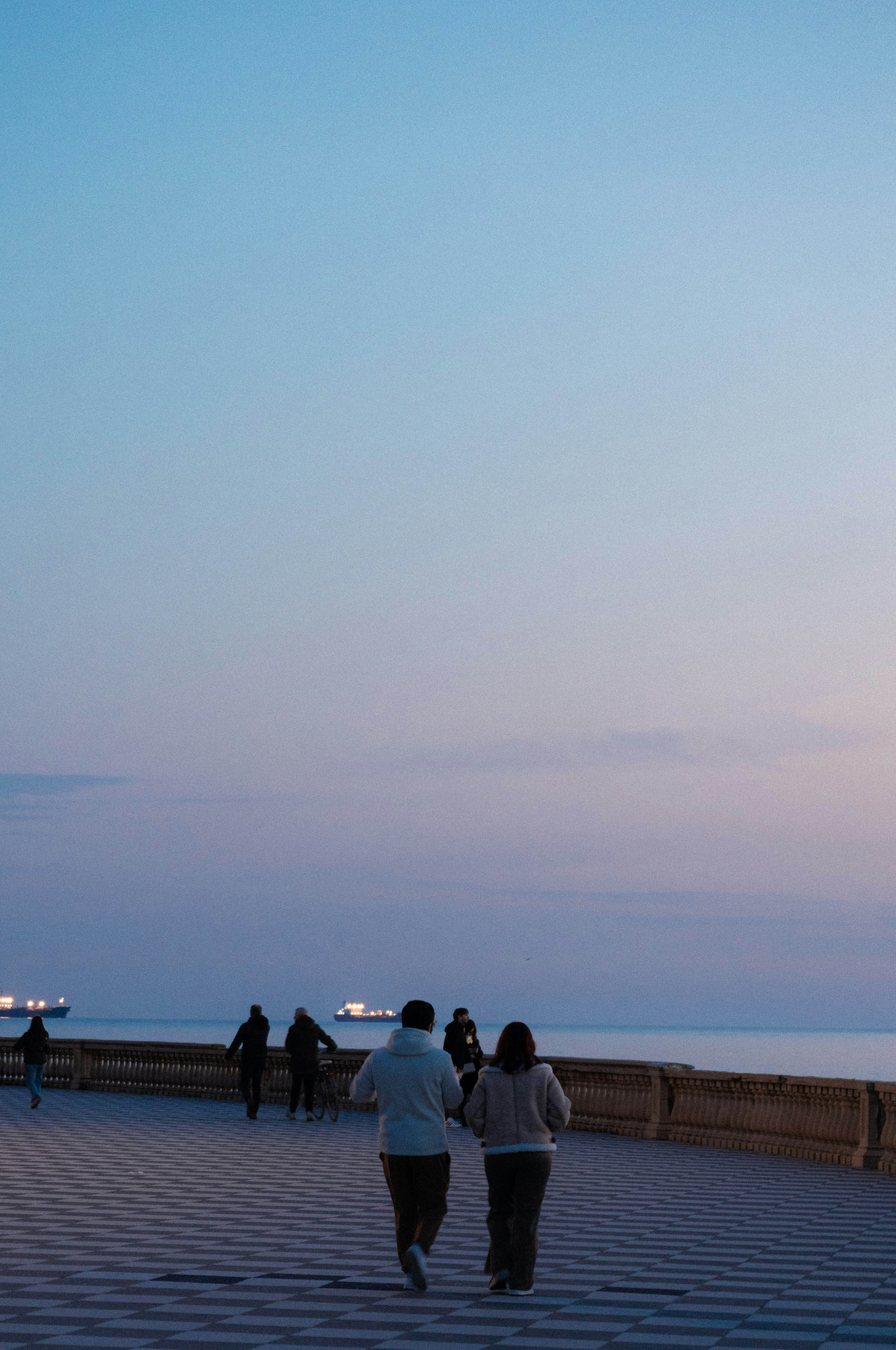 Evening Stroll Along a Checkerboard Promenade