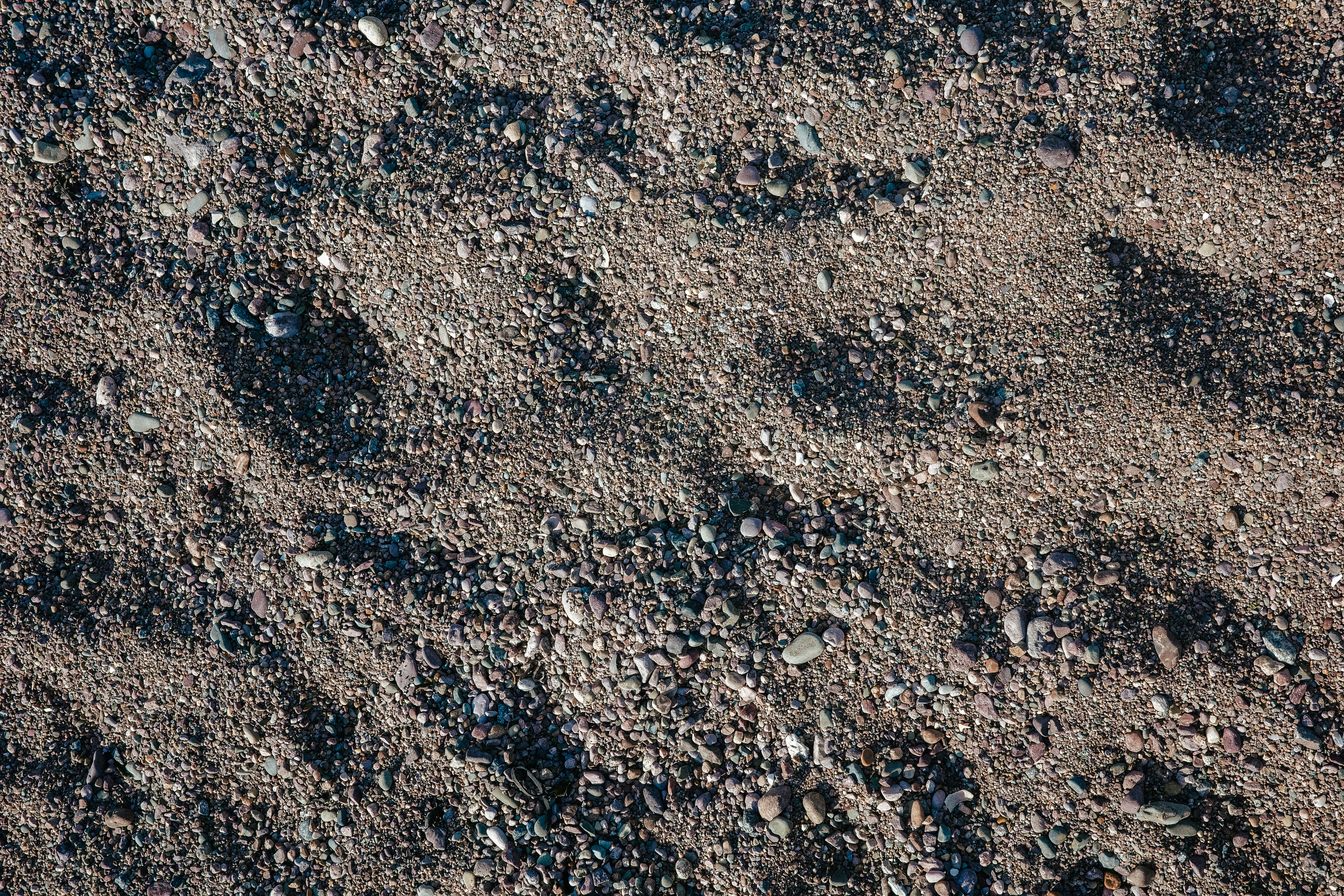 Granular Echoes: Close-Up of Desert Pebble Texture