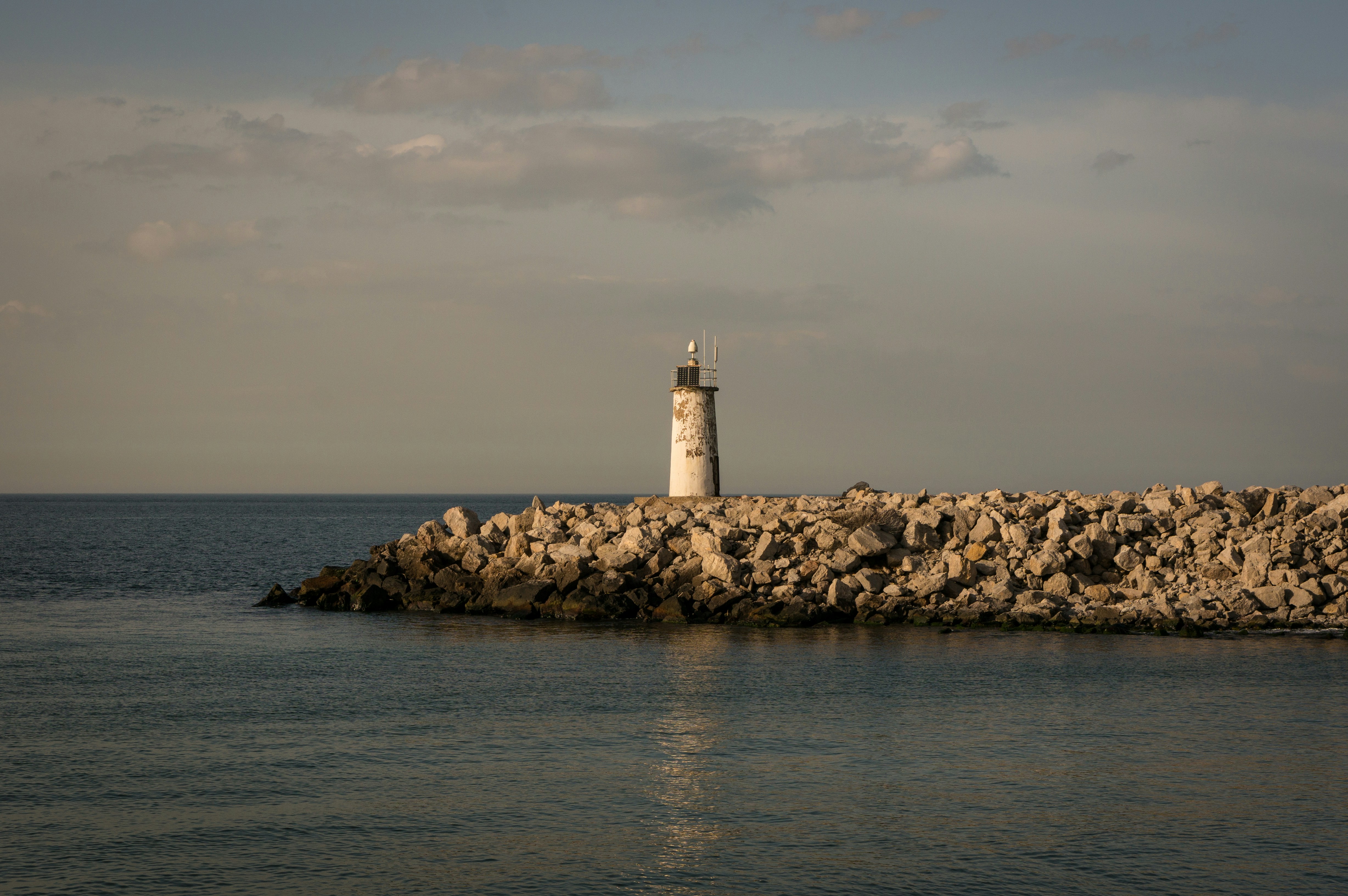 Lighthouse on a Quiet Breakwater