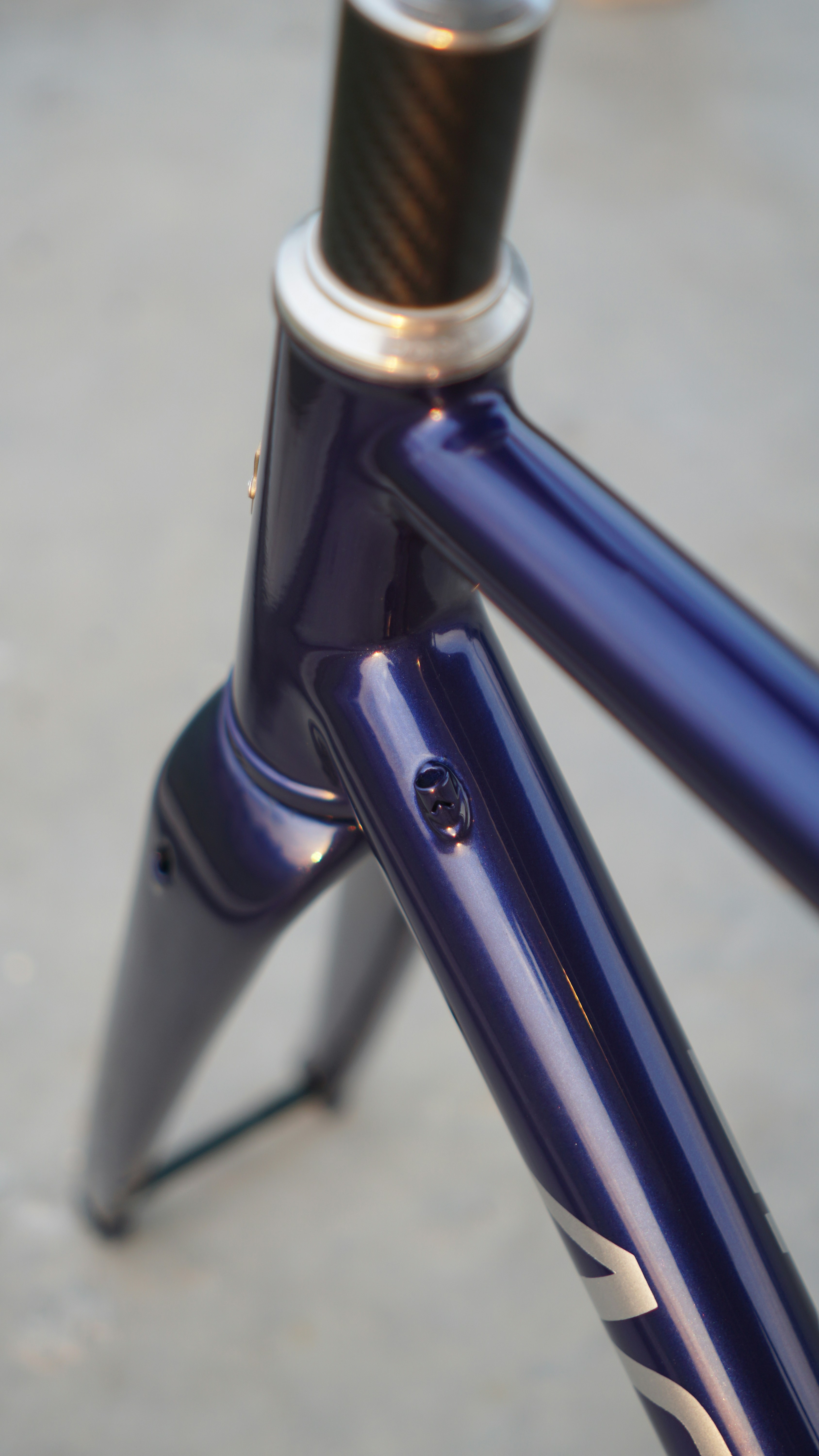 Blue Frame, Quiet Mechanism: Close-Up of a Bicycle's Joint and Seat Tube