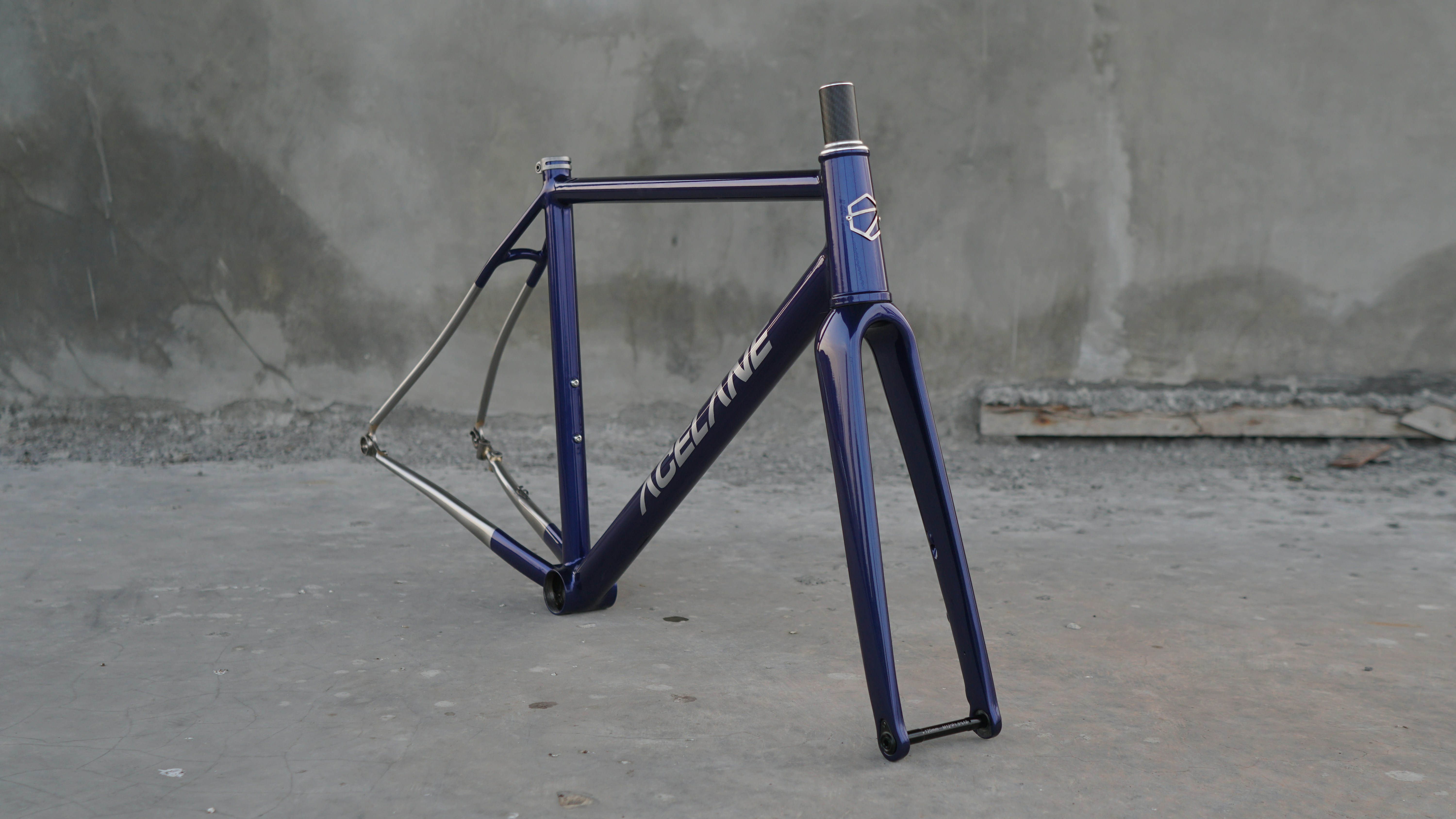 Abandoned Blue Road Frame Resting on a Rough Concrete Floor