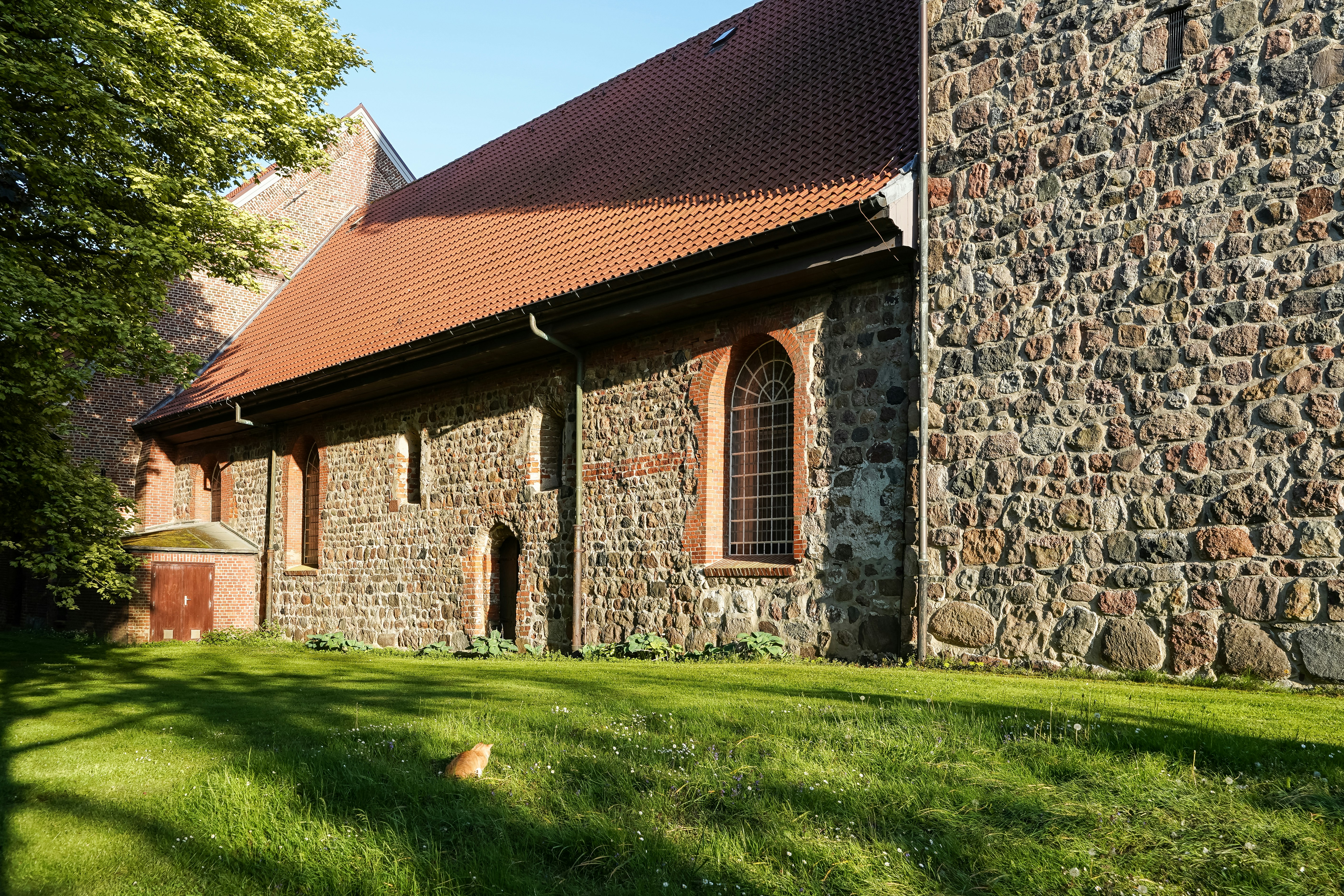 Sunlit Convent Walls: A Quiet Stone Corridor Needing Shade