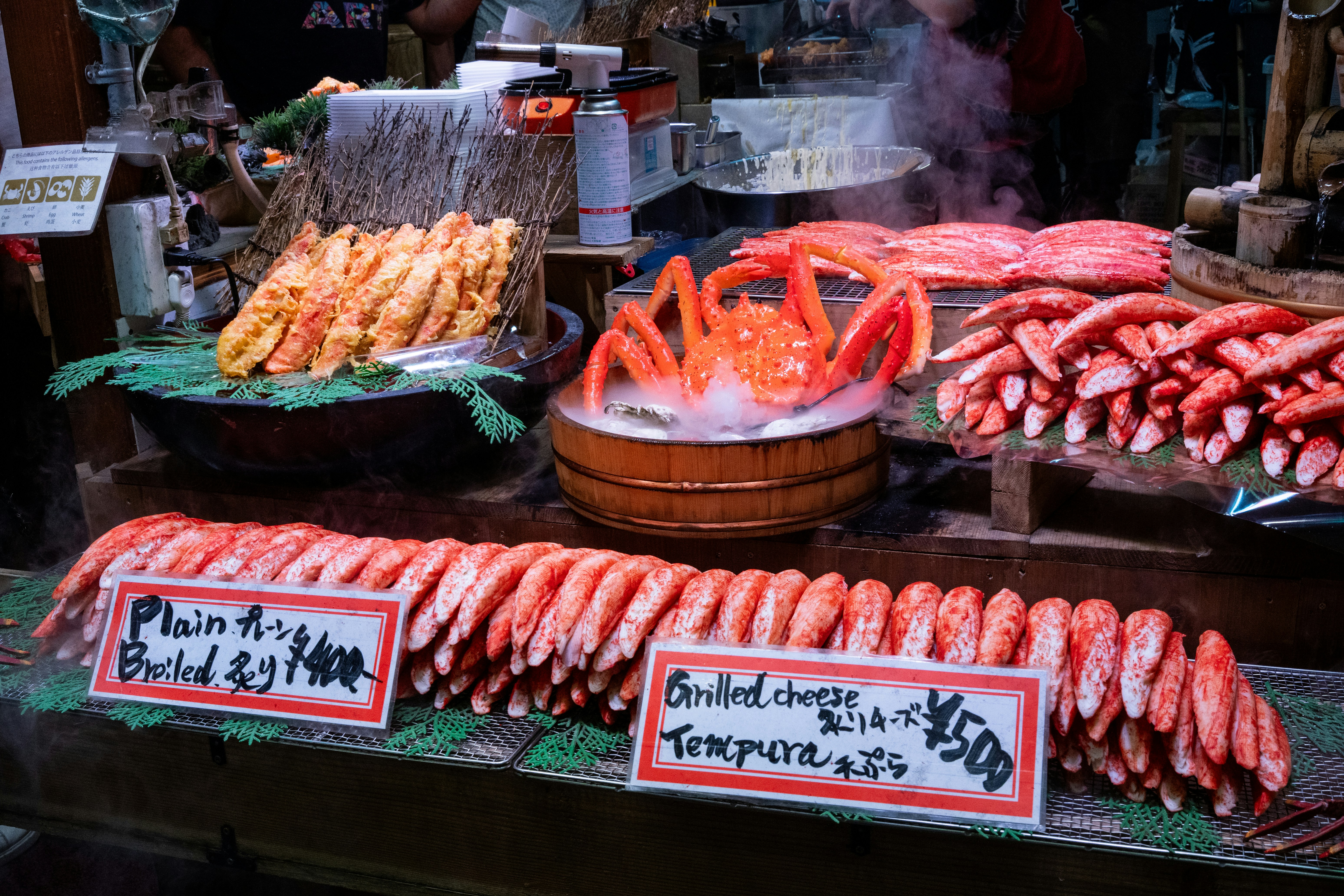 Steam-kissed Crab and Shrimp Display at a Bustling Market Window