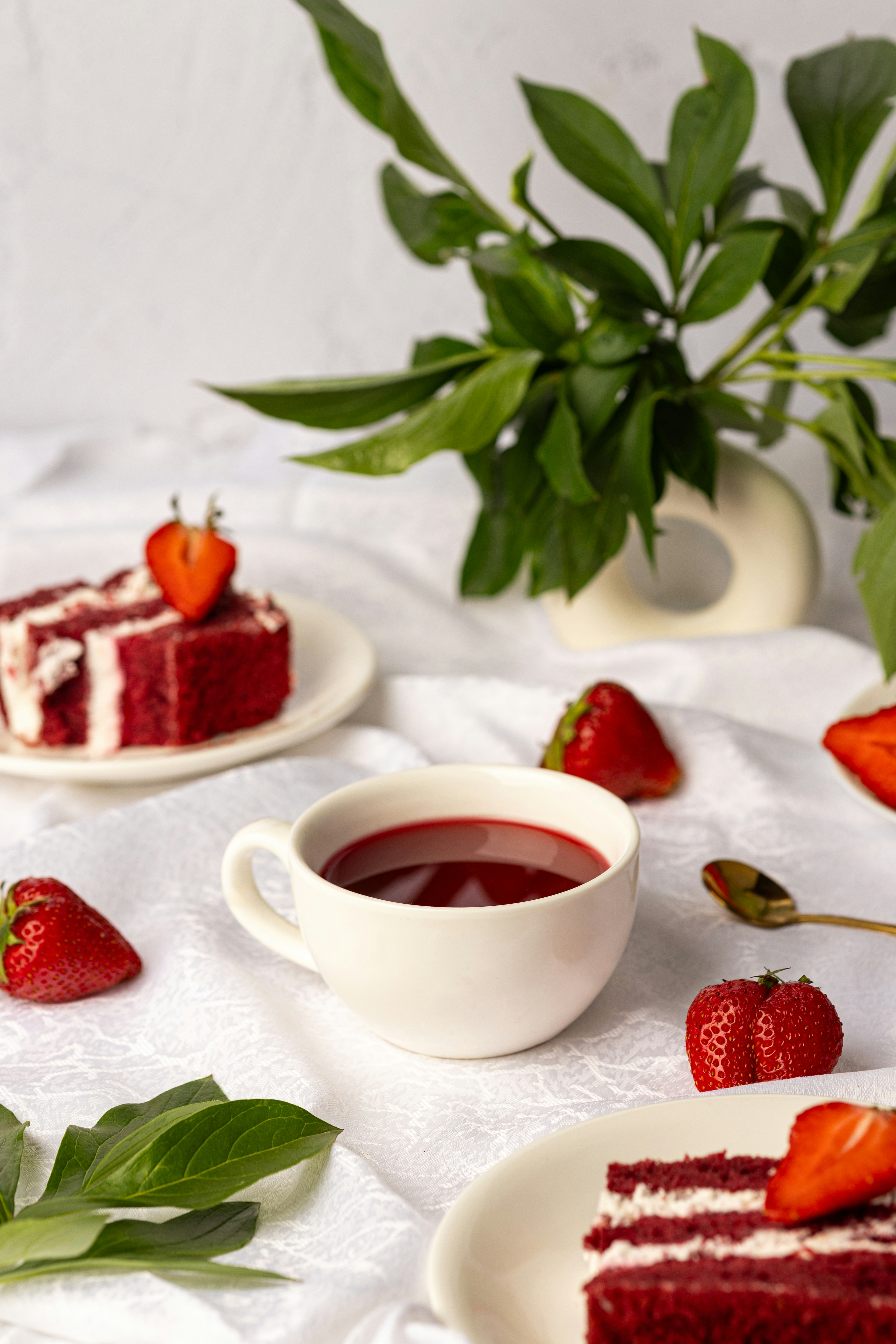 Strawberry Tapestry: A Quiet Dessert Scene with Red Velvet and Tea
