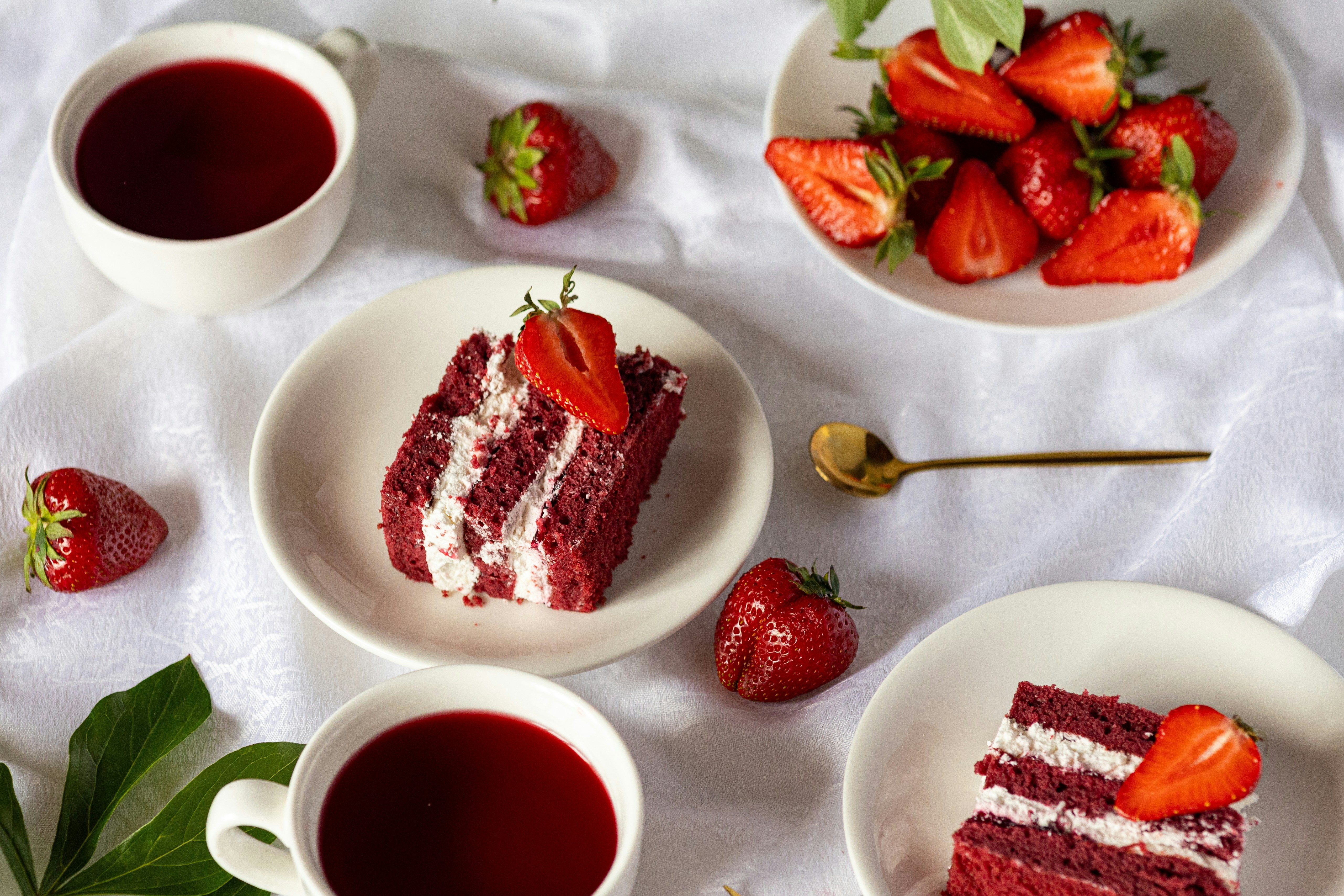 Strawberry-Glazed Chocolate Velvet Cakes on a White Table
