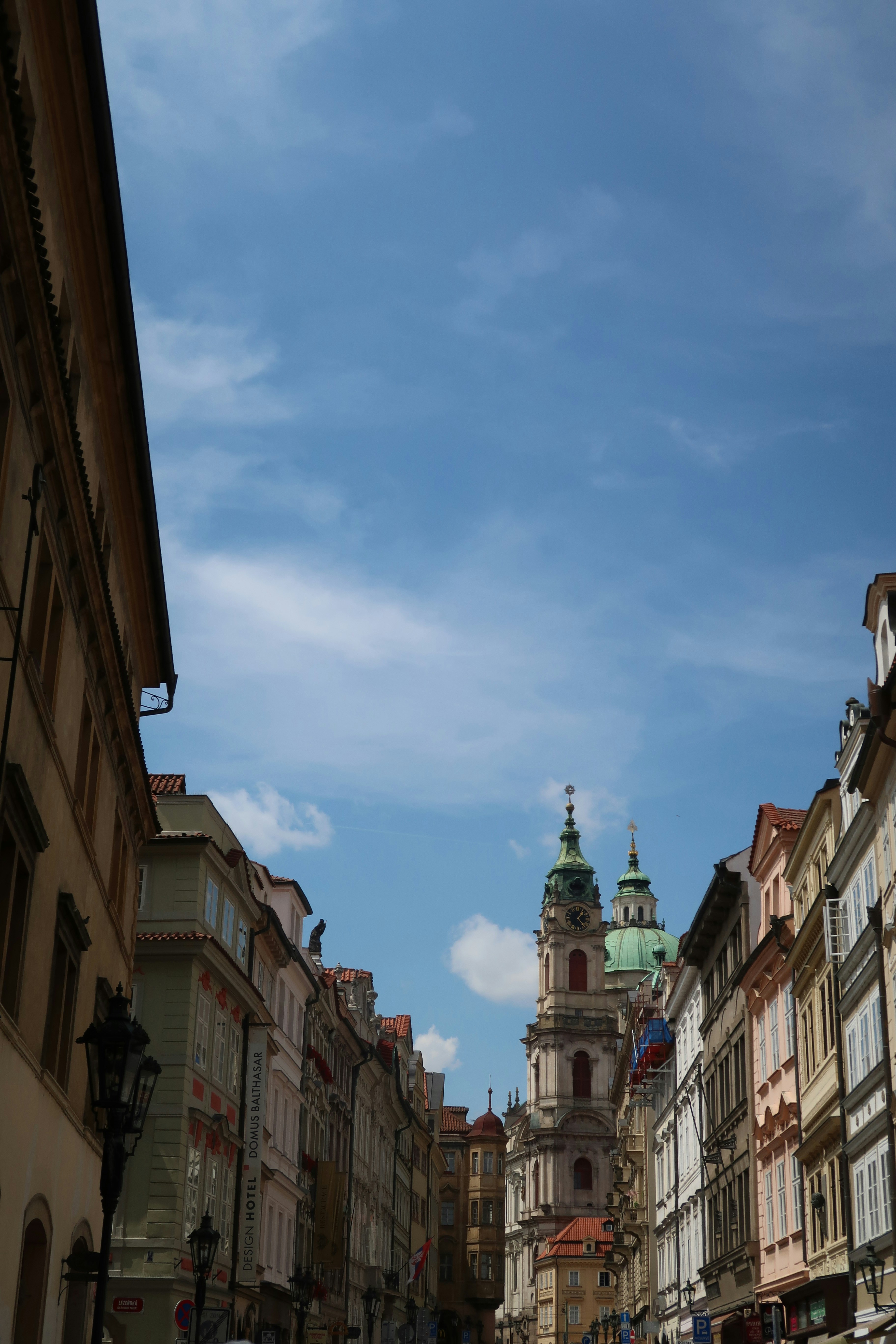 Street Cathedral in Focus: Sunlit Towers Framing a European Avenue