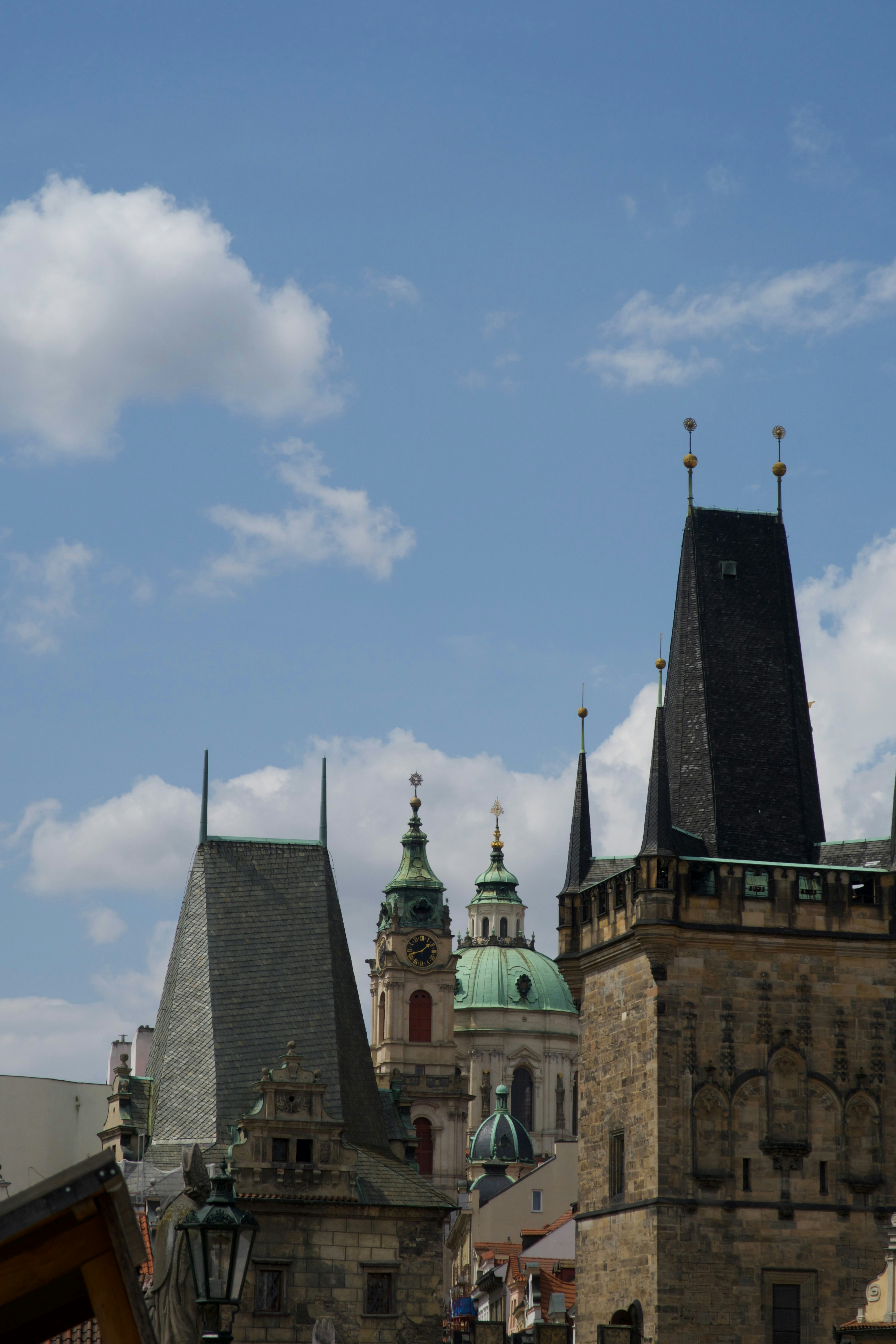 Gothic Towers Over Prague: A Quiet Cityscape Under Wide Sky