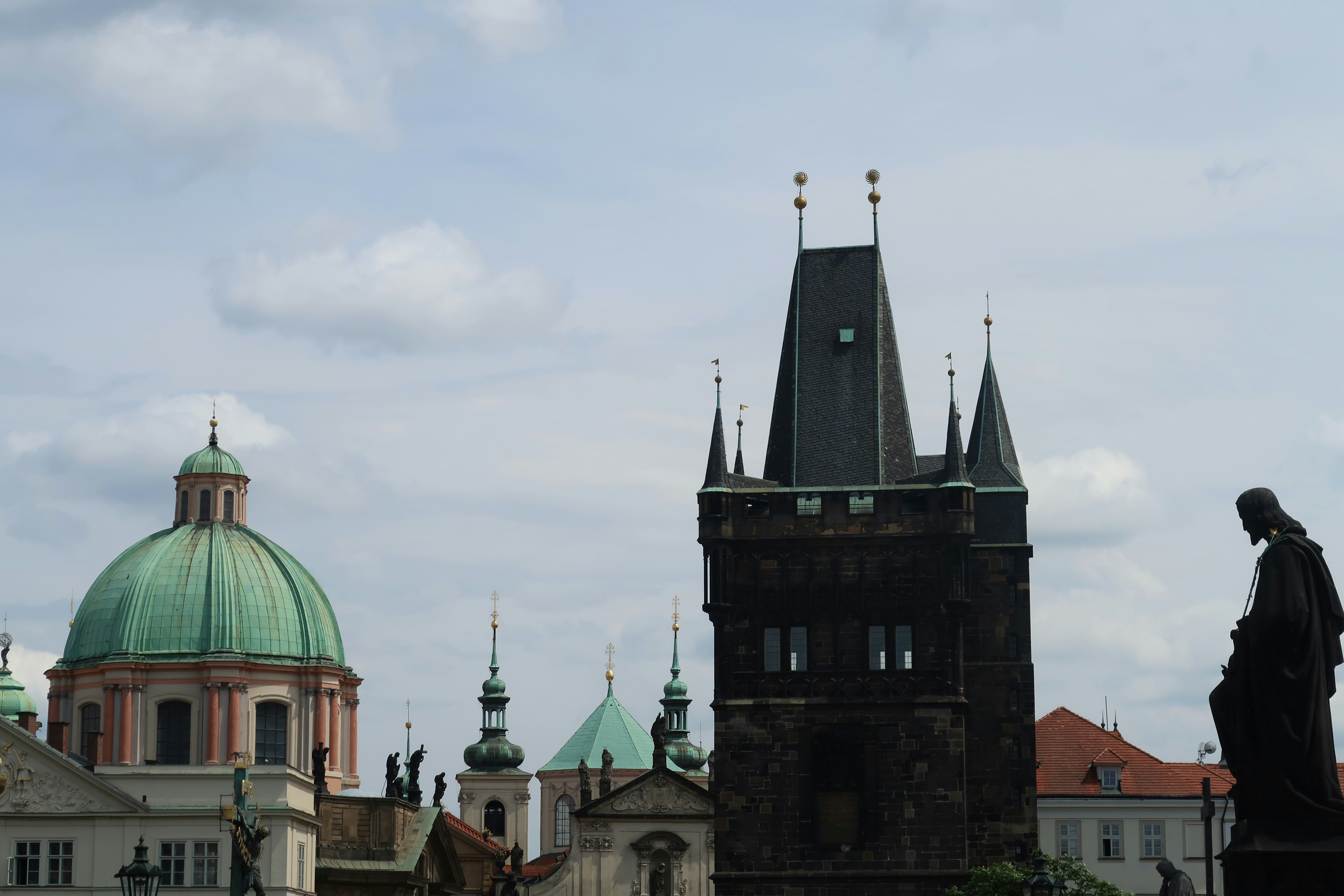 Towered Silhouette Over Prague: A Quiet Rooftop Vista