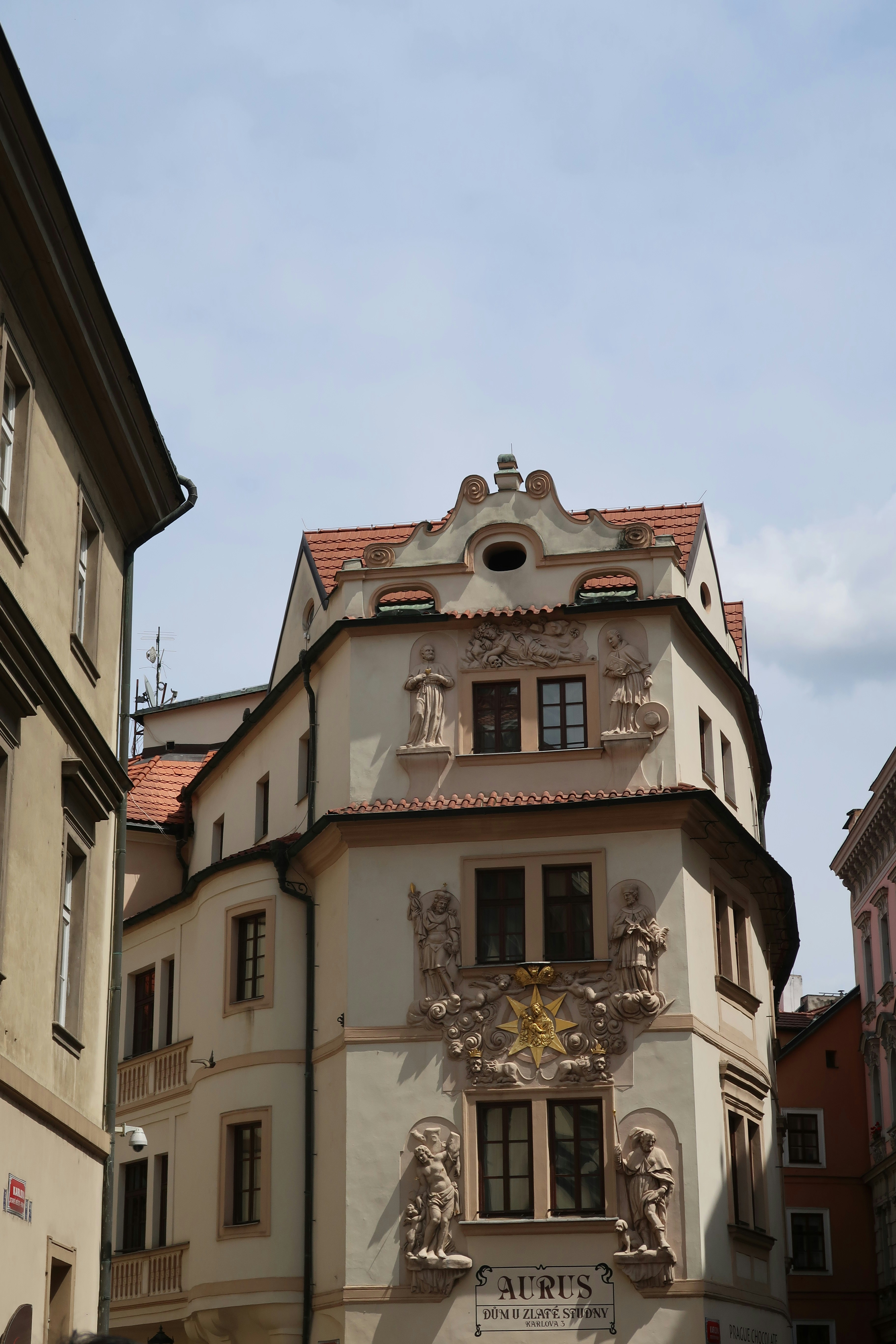 Ornate Facade Rising Above Narrow Cobblestones
