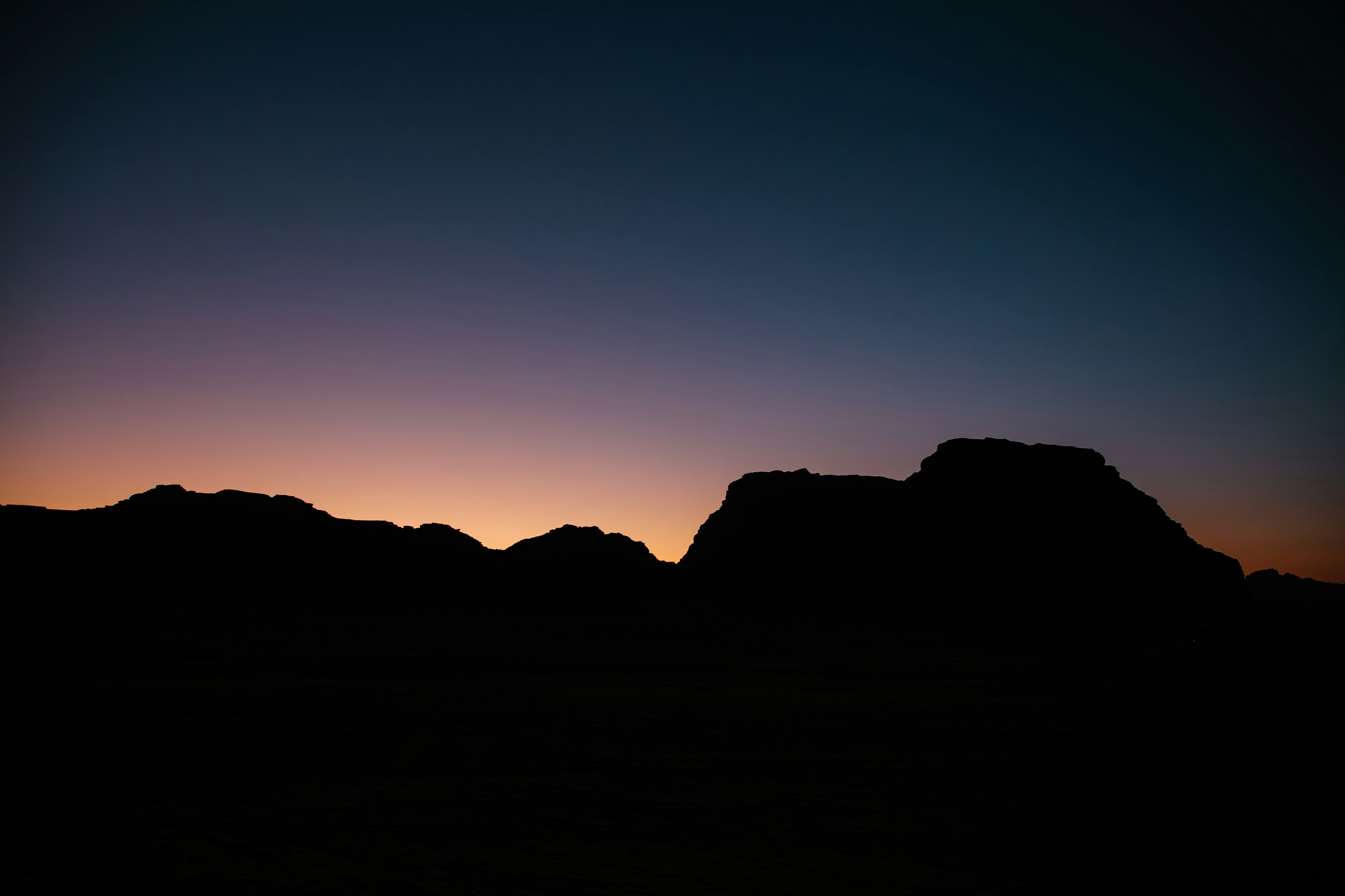 Dawn Silhouette Over Desert Ridge