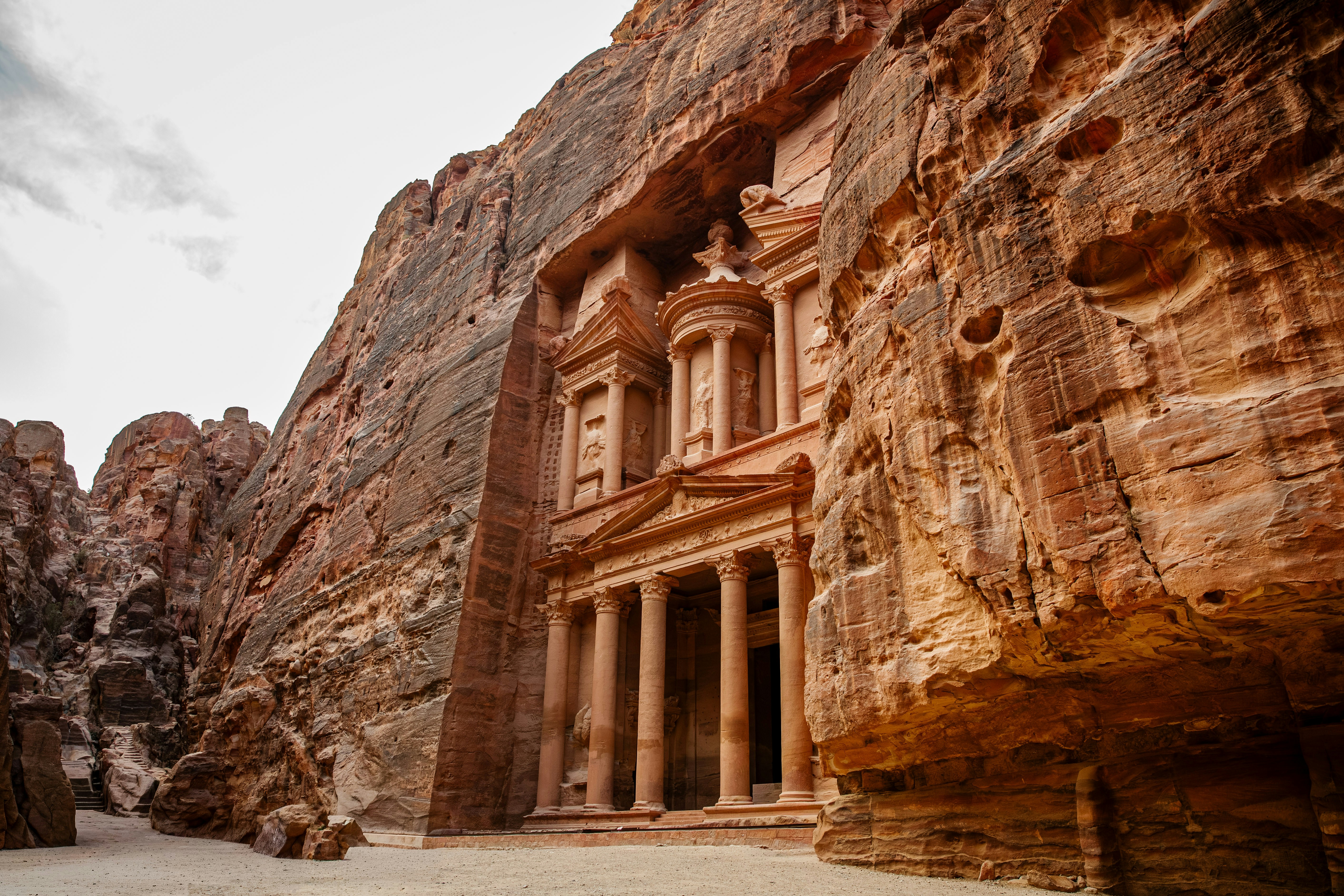 Carved Into Time: An Ancient Facade Nestled in Red Canyon Cliffs