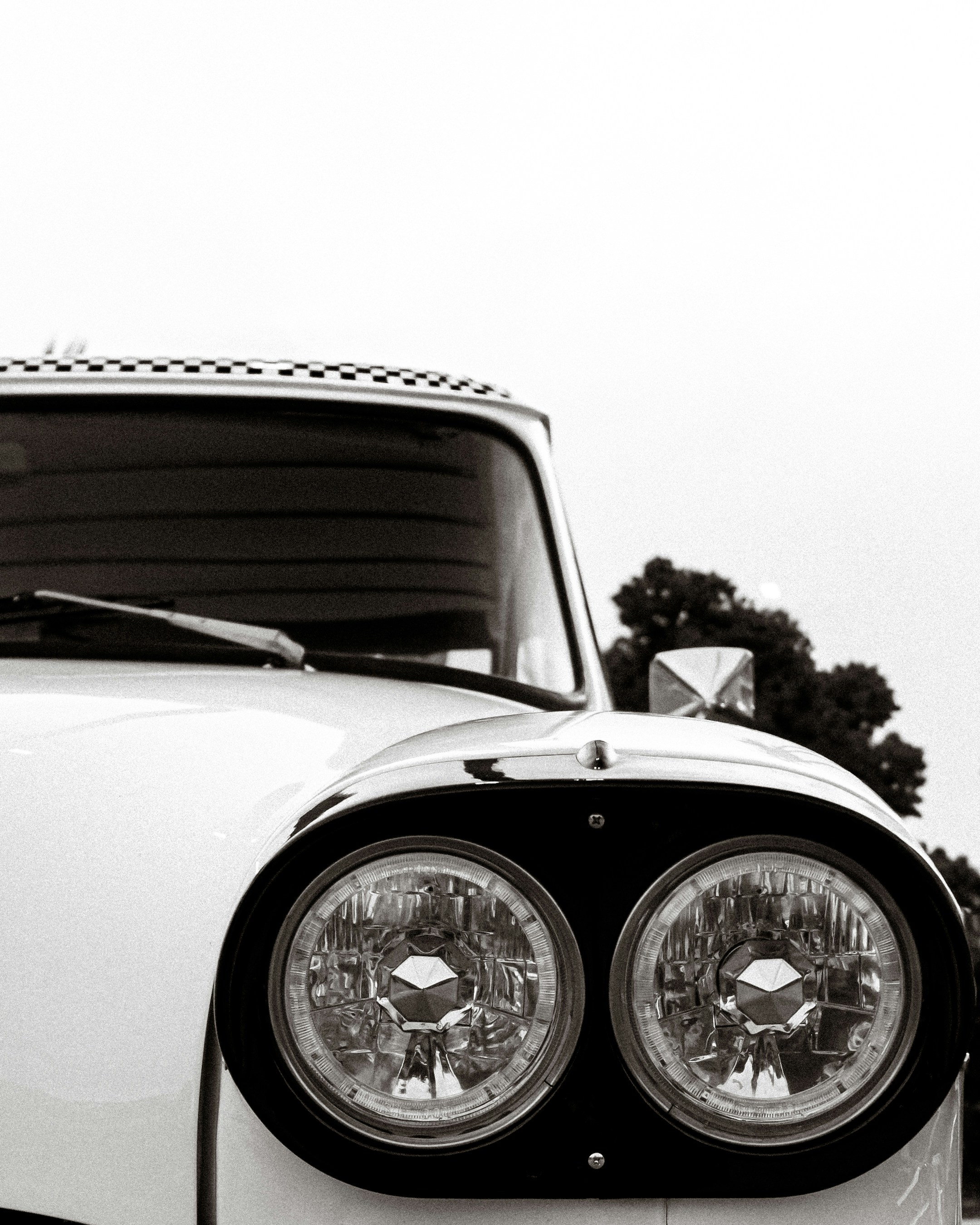 Chrome Twins: The Front Lens of a Classic Automobile