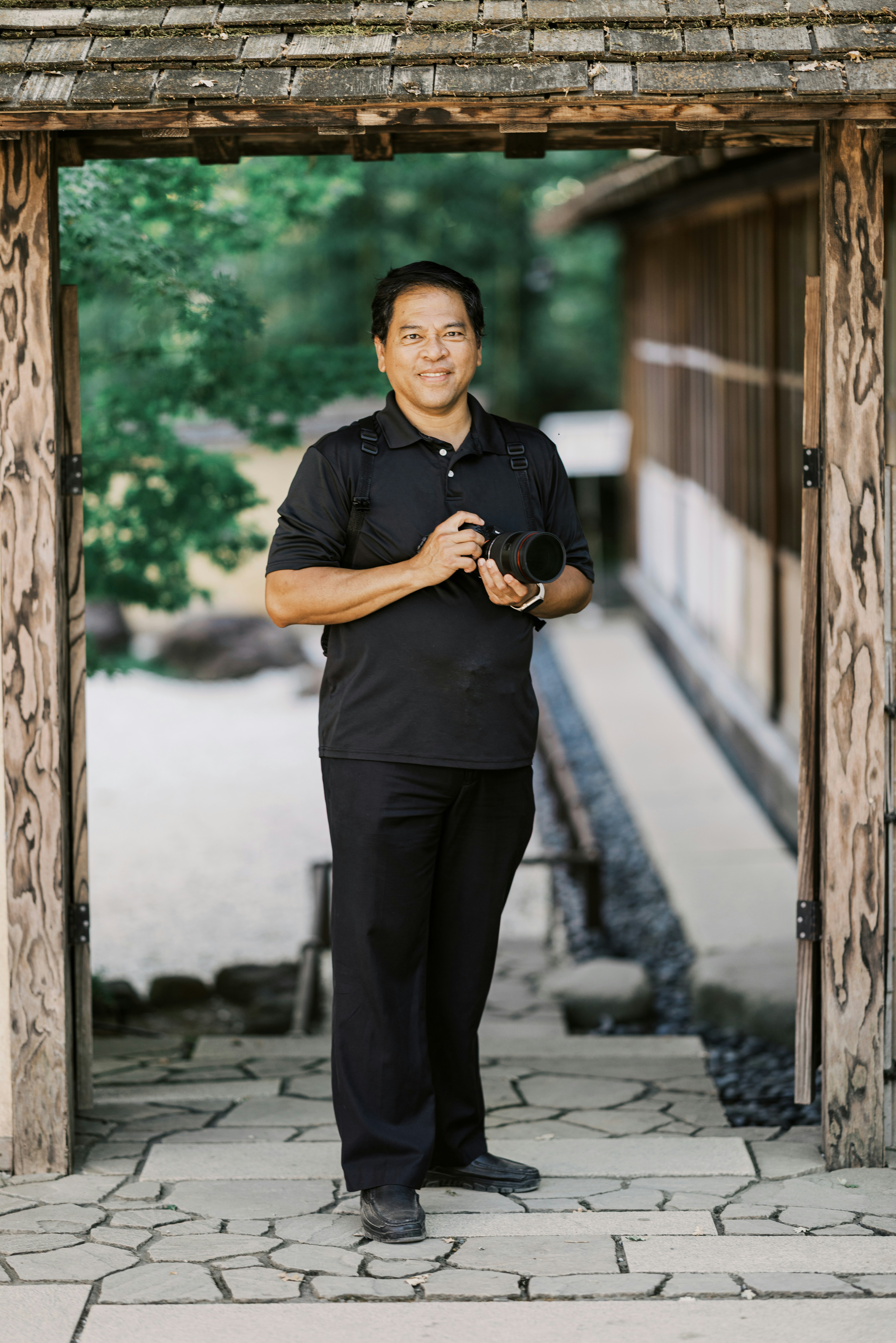 Gentle Portrait Behind a Traditional Gate