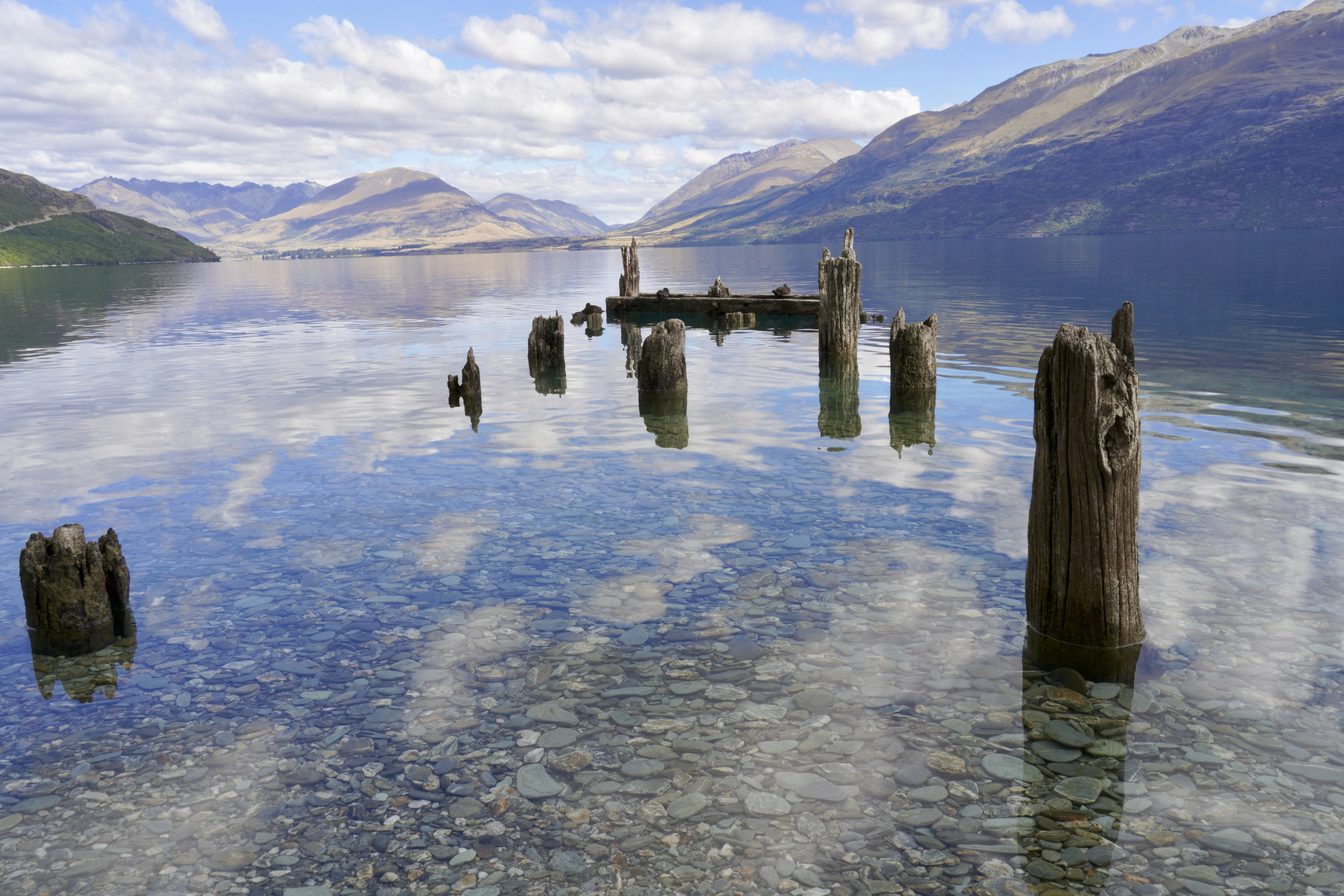 Stone Pier Echoes over a Glassy Lake