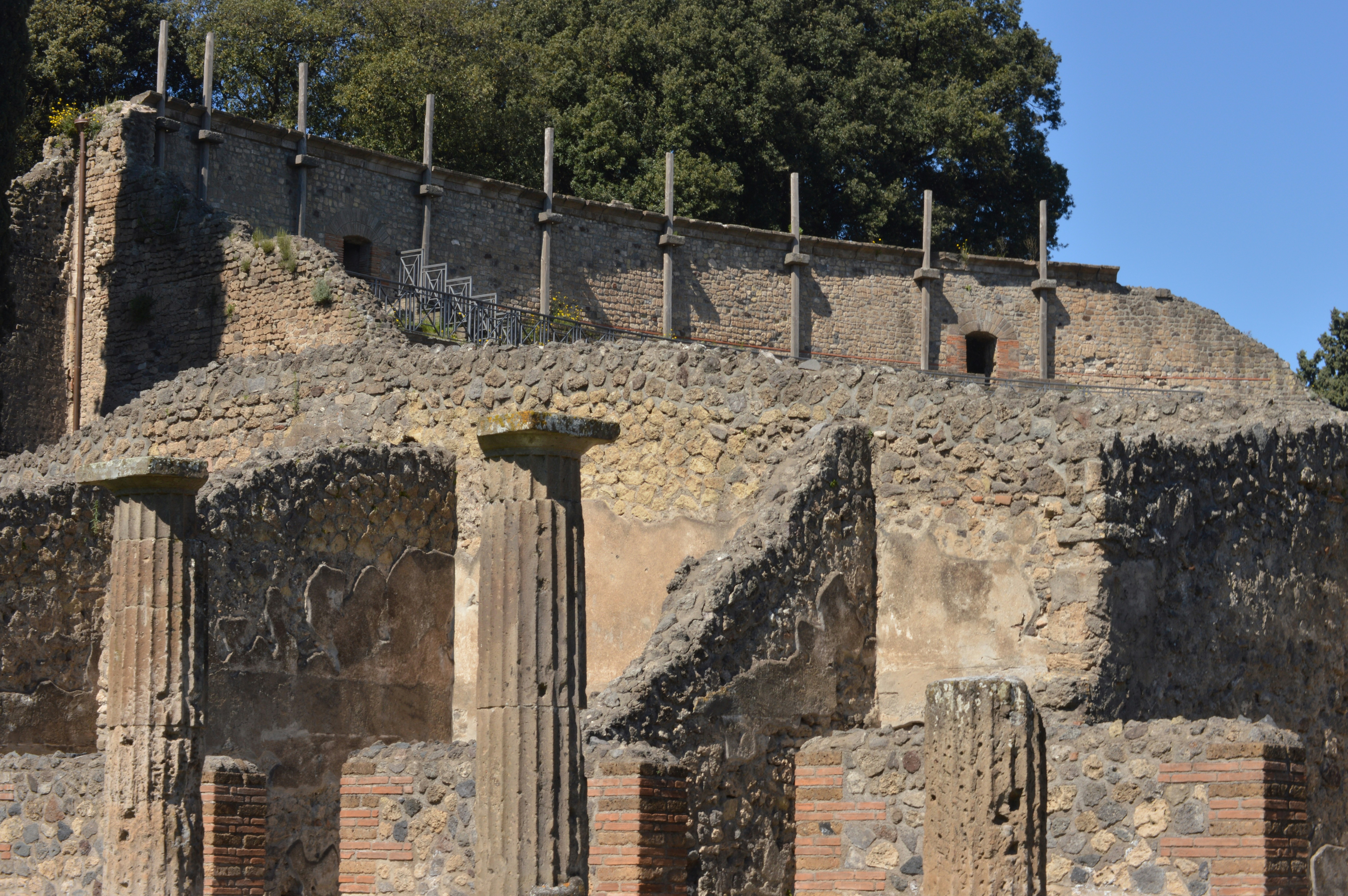 Ancient Ruins: Weathered Stone Walls and Columns Silent under Sunlight