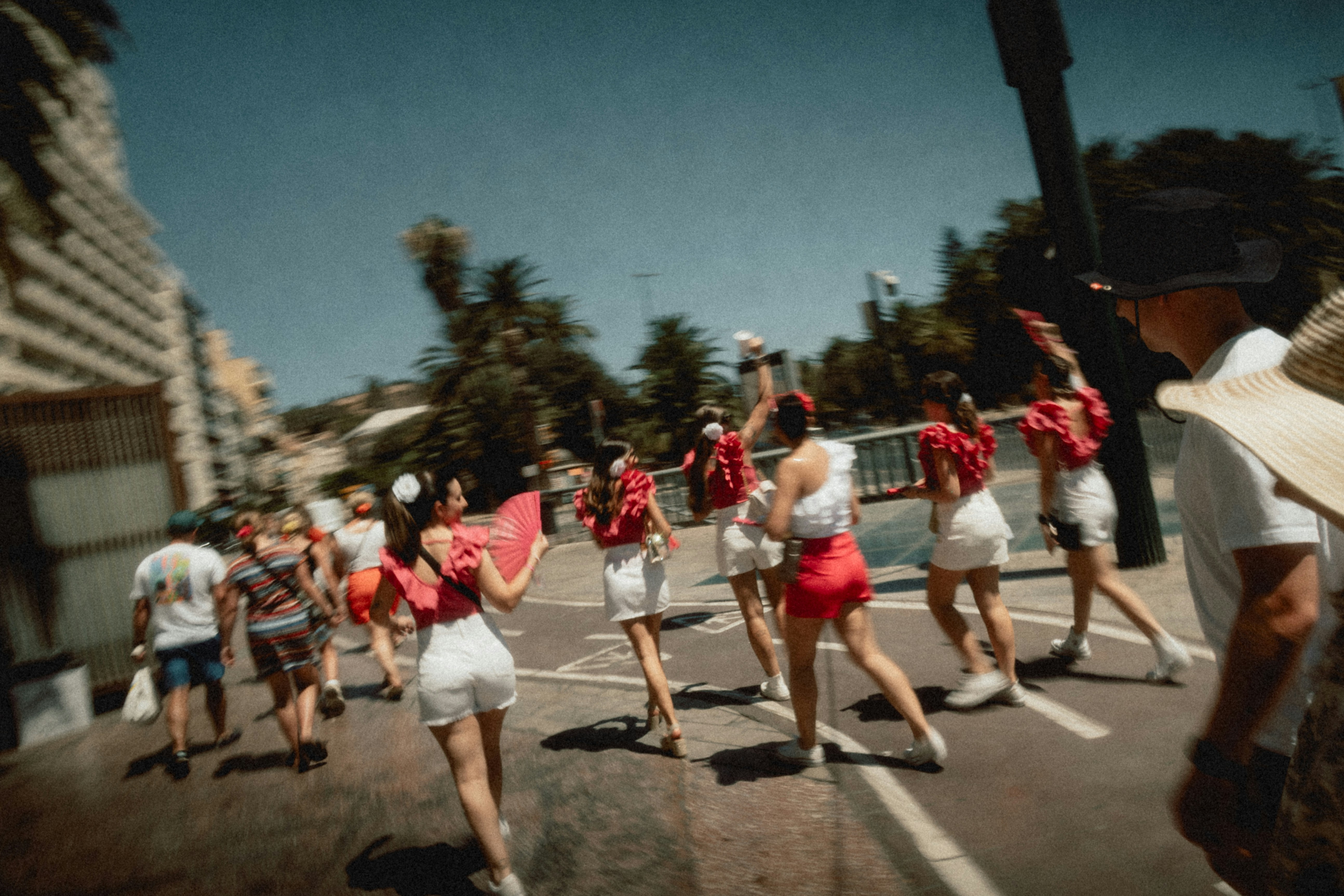 Marching Cheer: A Sunlit Street Parade in Motion