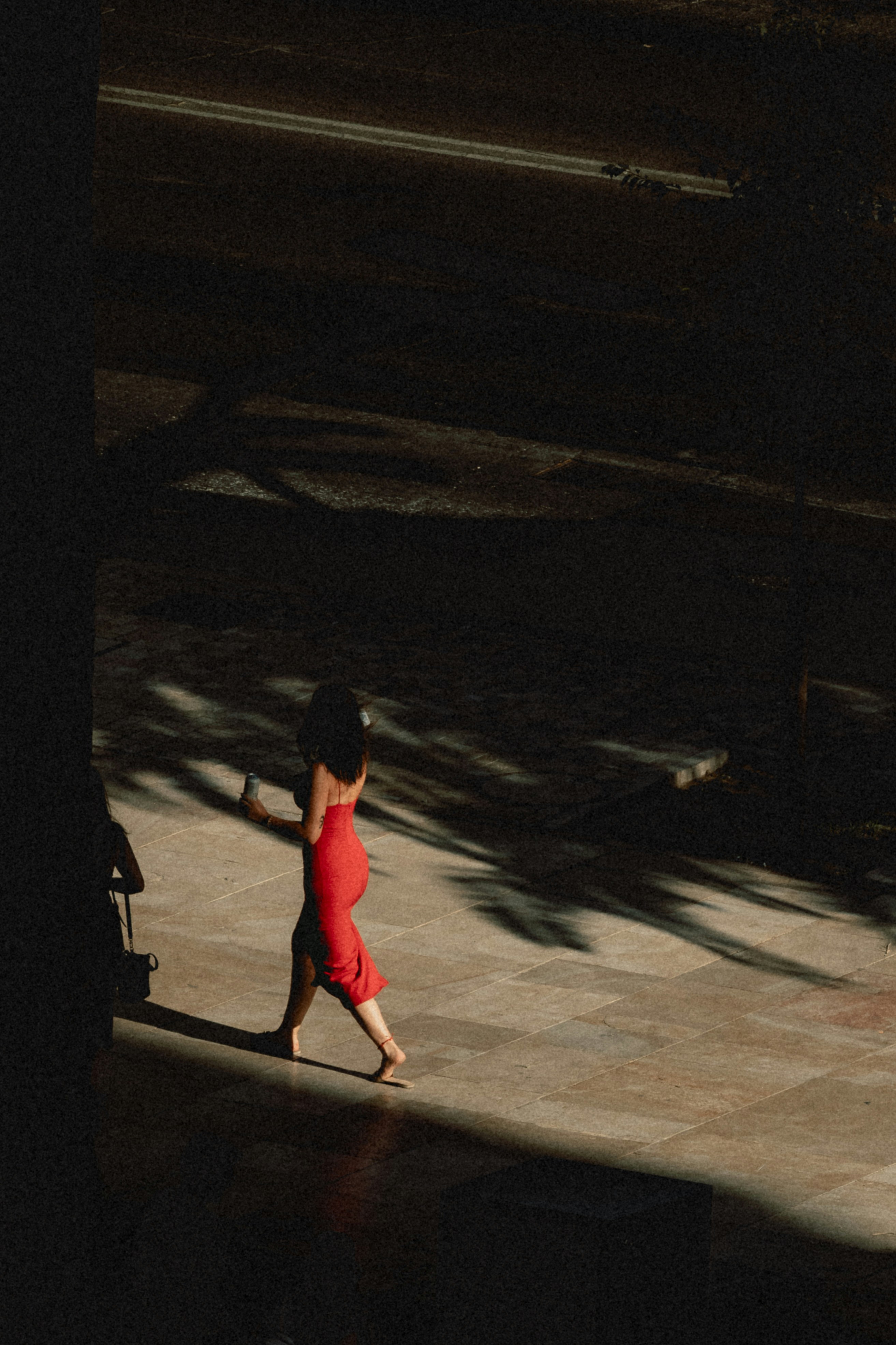 Red Dress in a Sliver of Sunlight