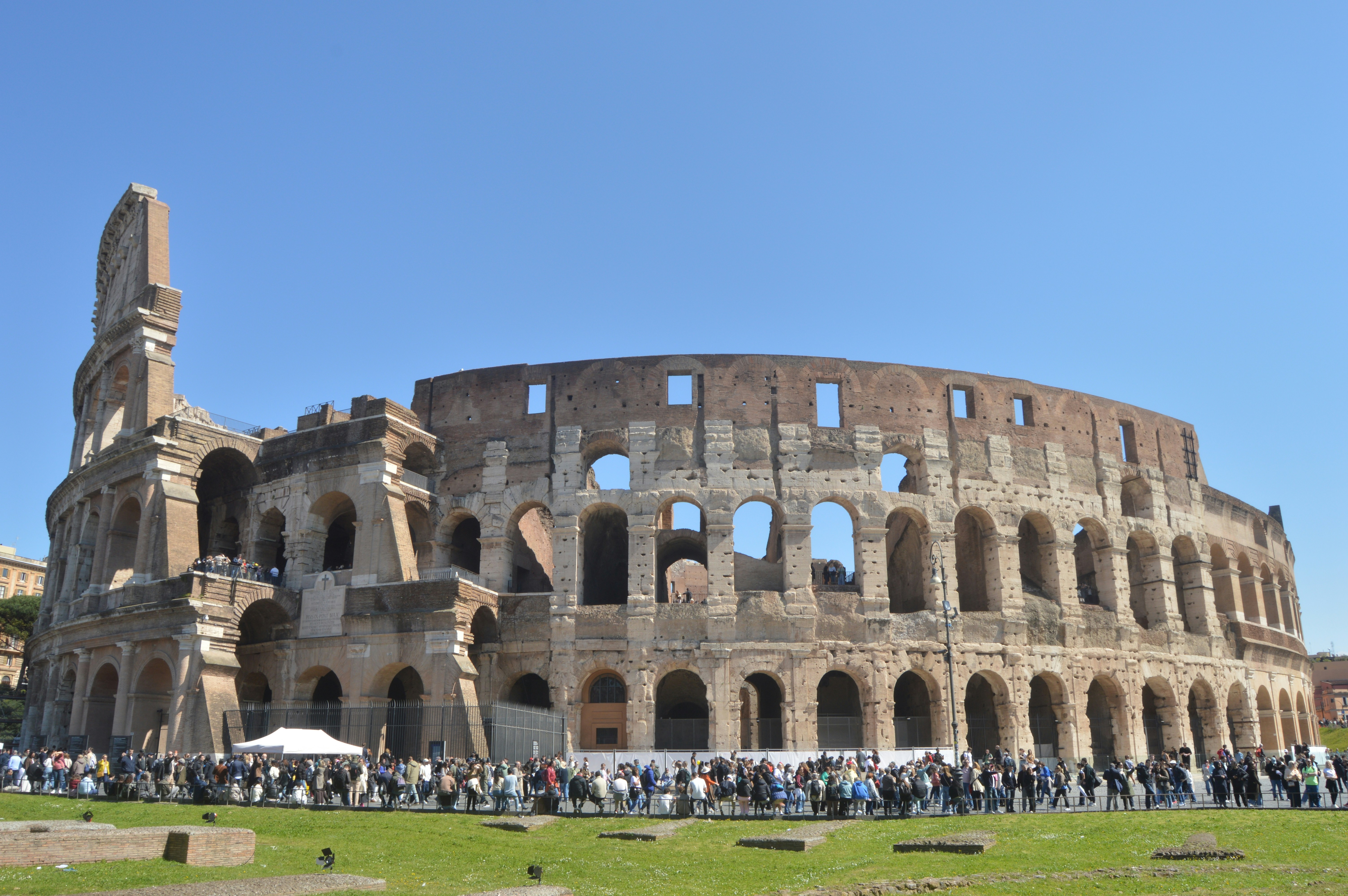 Colosseum in Full Bloom: A Sea of Visitors Beneath Ancient Arches