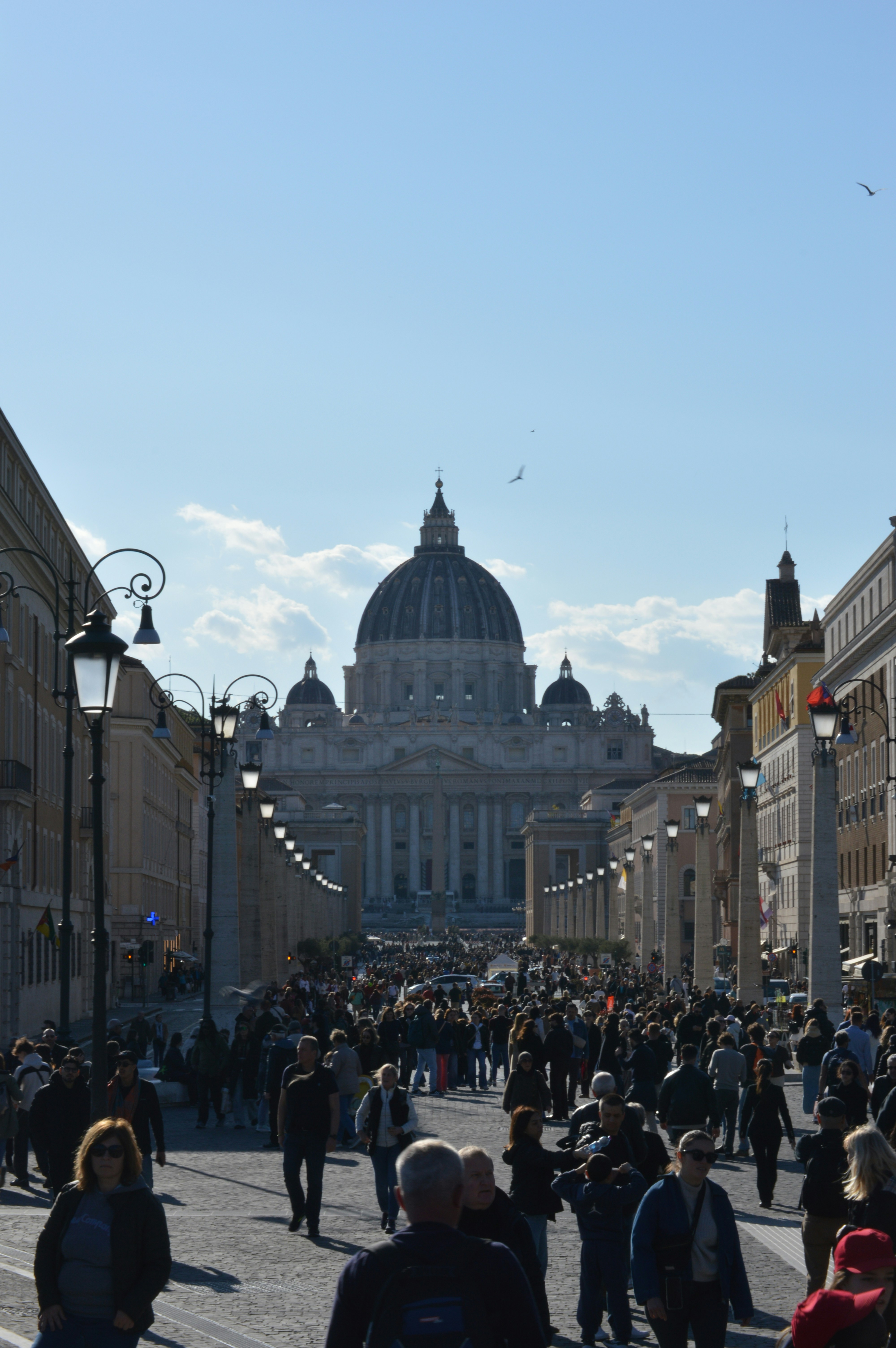St. Peter's Basilica Aglow Beyond a Bustling Via della Conciliazione
