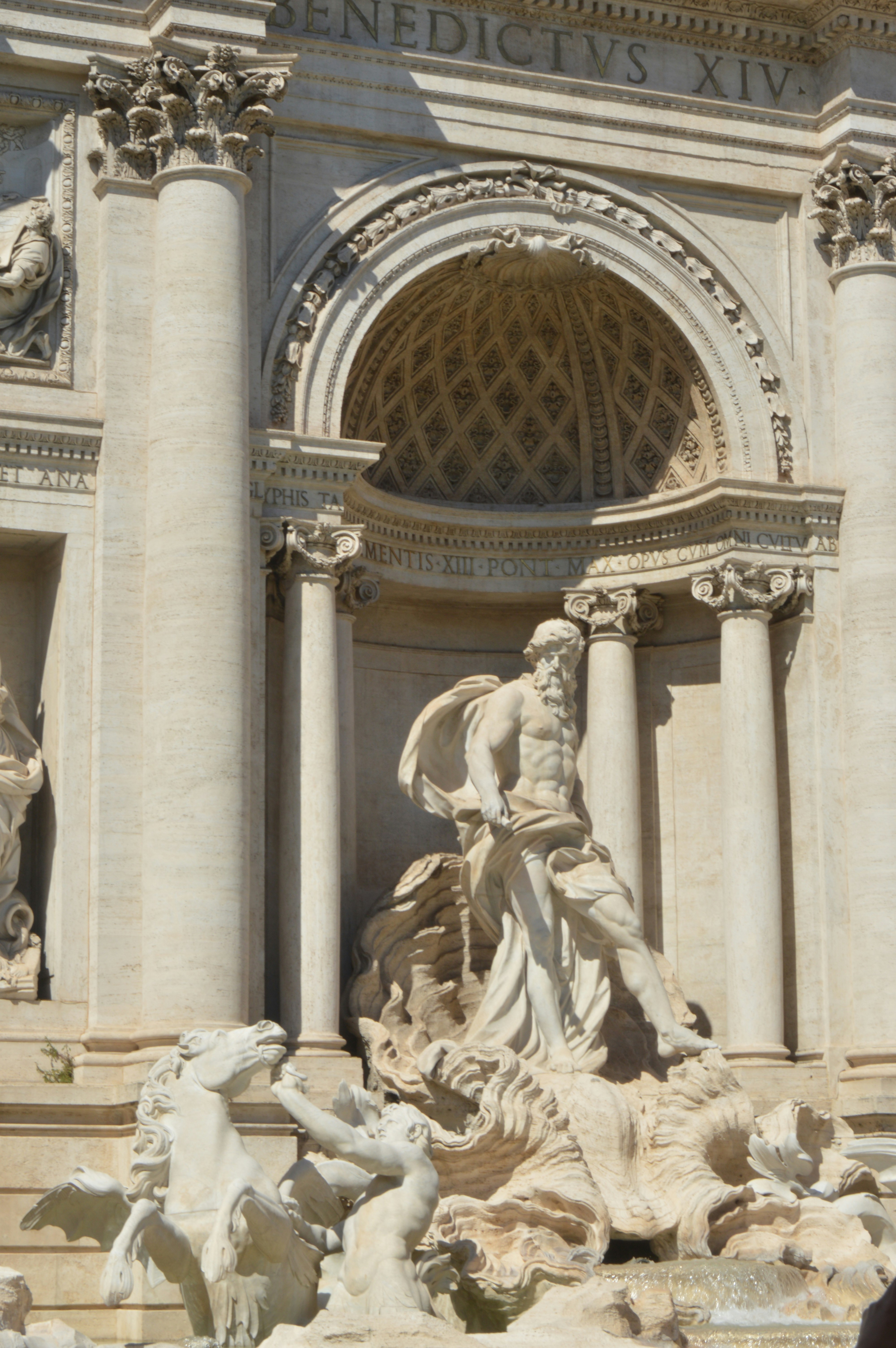 Ancient Fountain Statue Framed by Ornate Archway